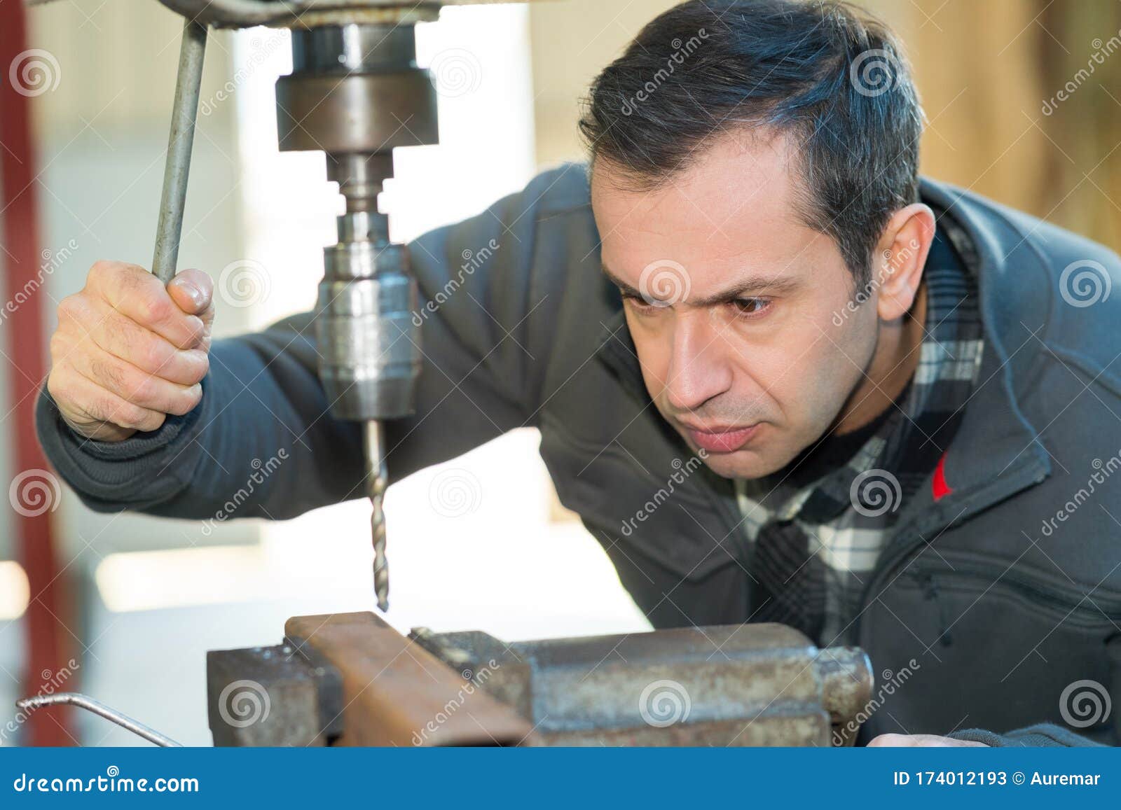 Man Lowering Drill Bit on To Metal Stock Image - Image of vise ...