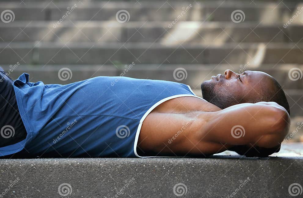 Man Lying on Back Resting Outside Stock Image - Image of looking, lying ...