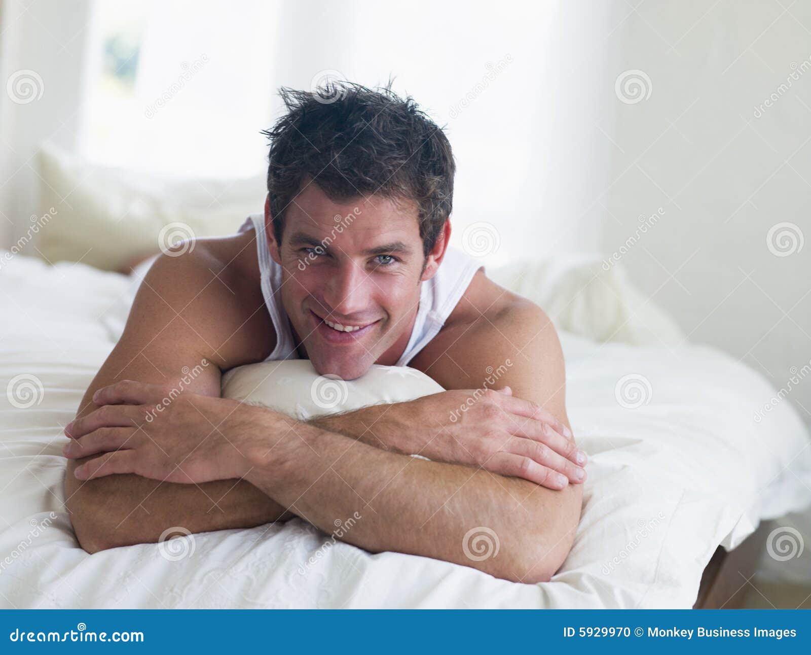 Man lying in bed stock photo. Image of happy, nightwear - 5929970