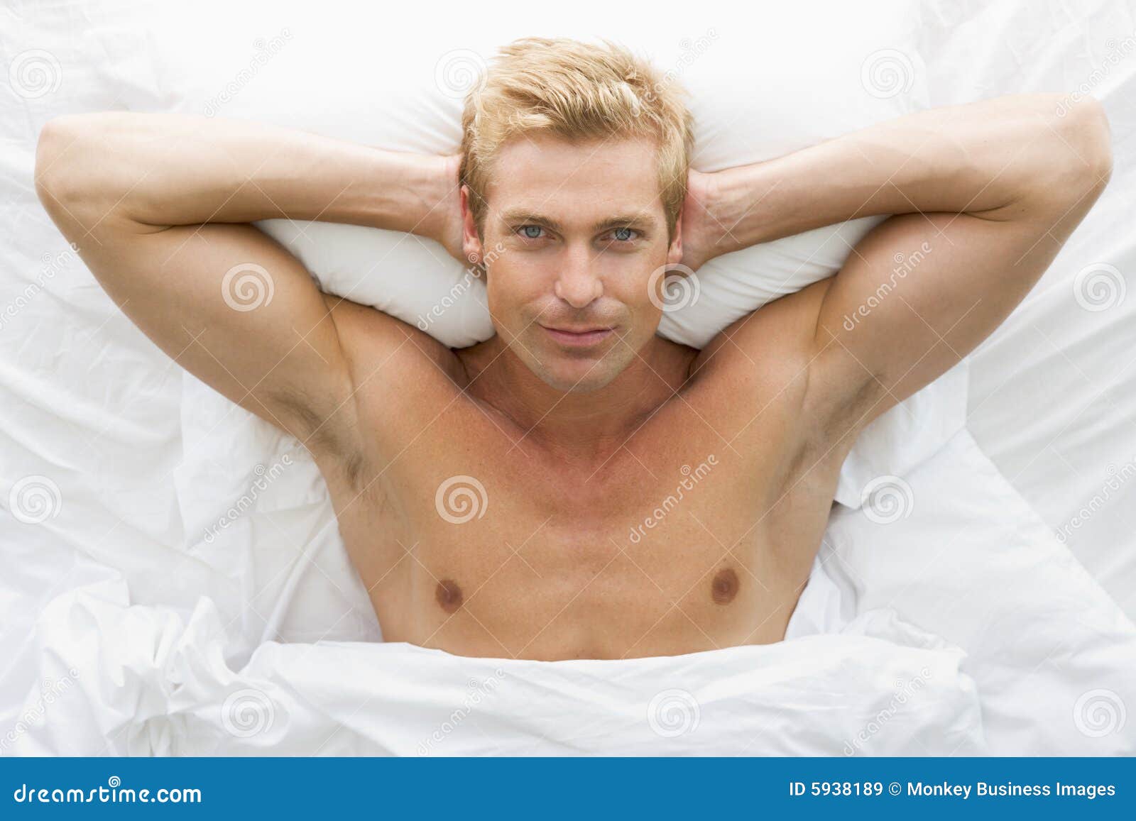 Man lying in bed relaxing stock image. Image of lying - 5938189