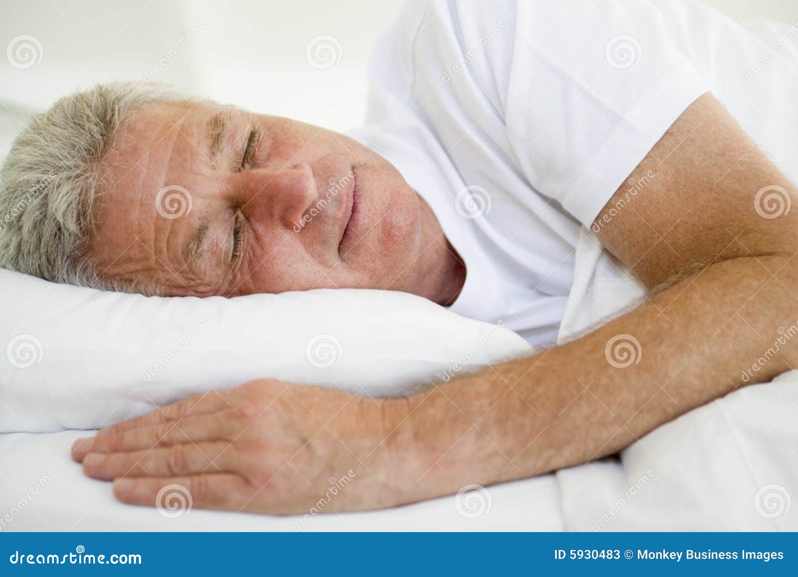 Man lying in bed sleeping stock image. Image of fifties - 5930483