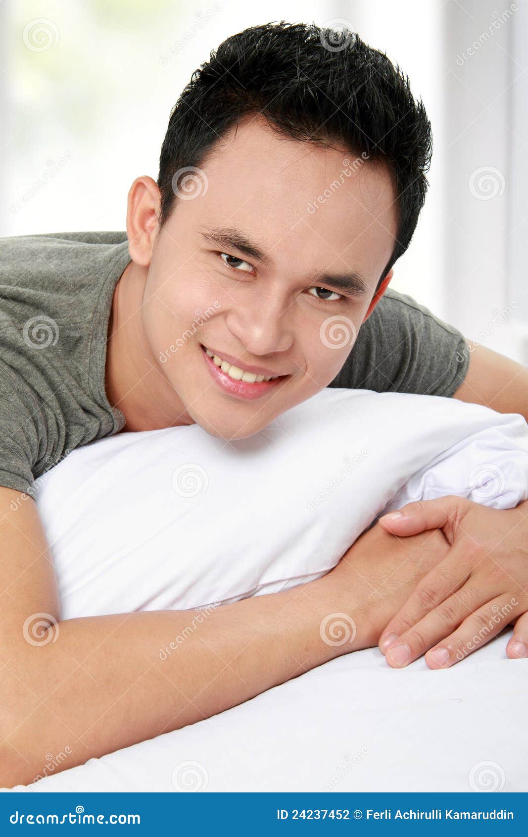 Man lying in bed smiling stock photo. Image of nightwear - 24237452
