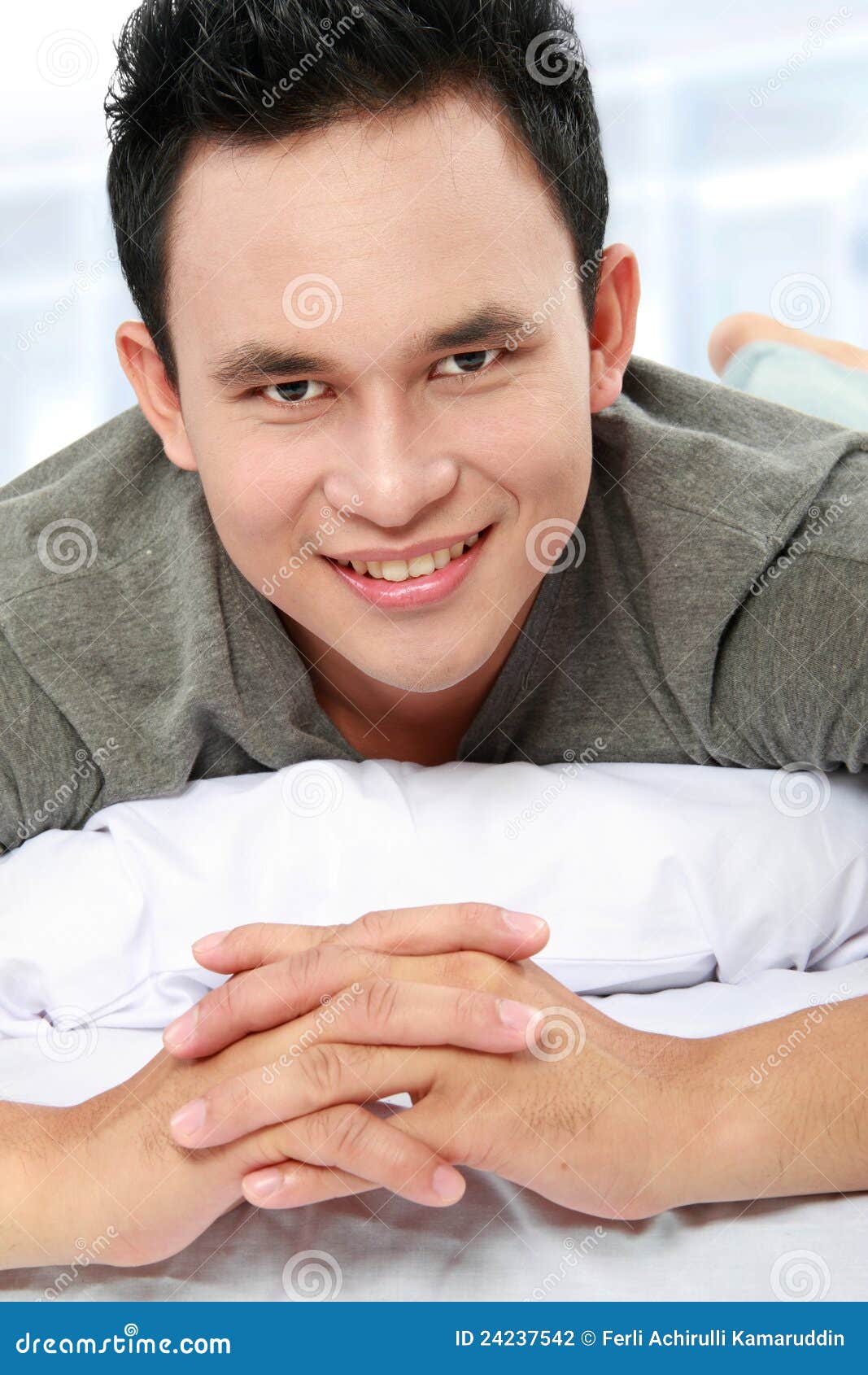 Man lying in bed smiling stock photo. Image of smiling - 24237542
