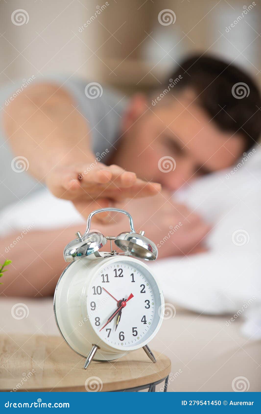 Man Lying on Bed and Stopping Alarm Clock Stock Photo - Image of clock ...