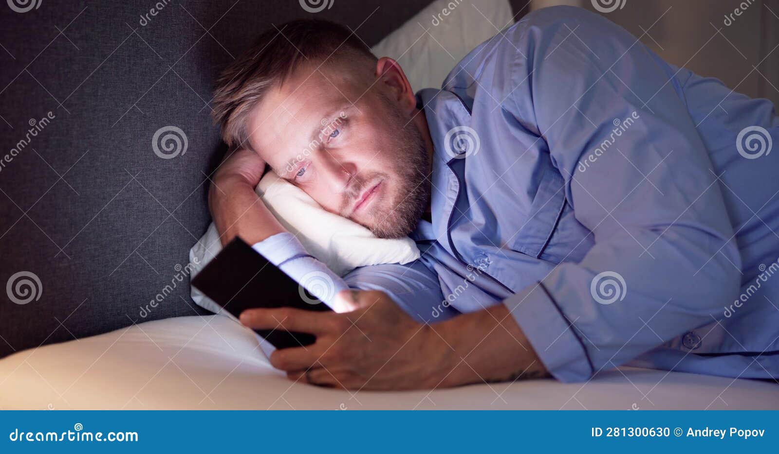 Man Lying on Bed Using Mobile Phone Stock Photo - Image of wireless ...