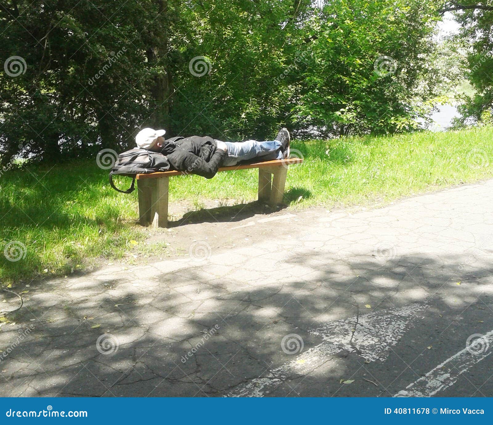 Man lying bench editorial stock photo. Image of park - 40811678