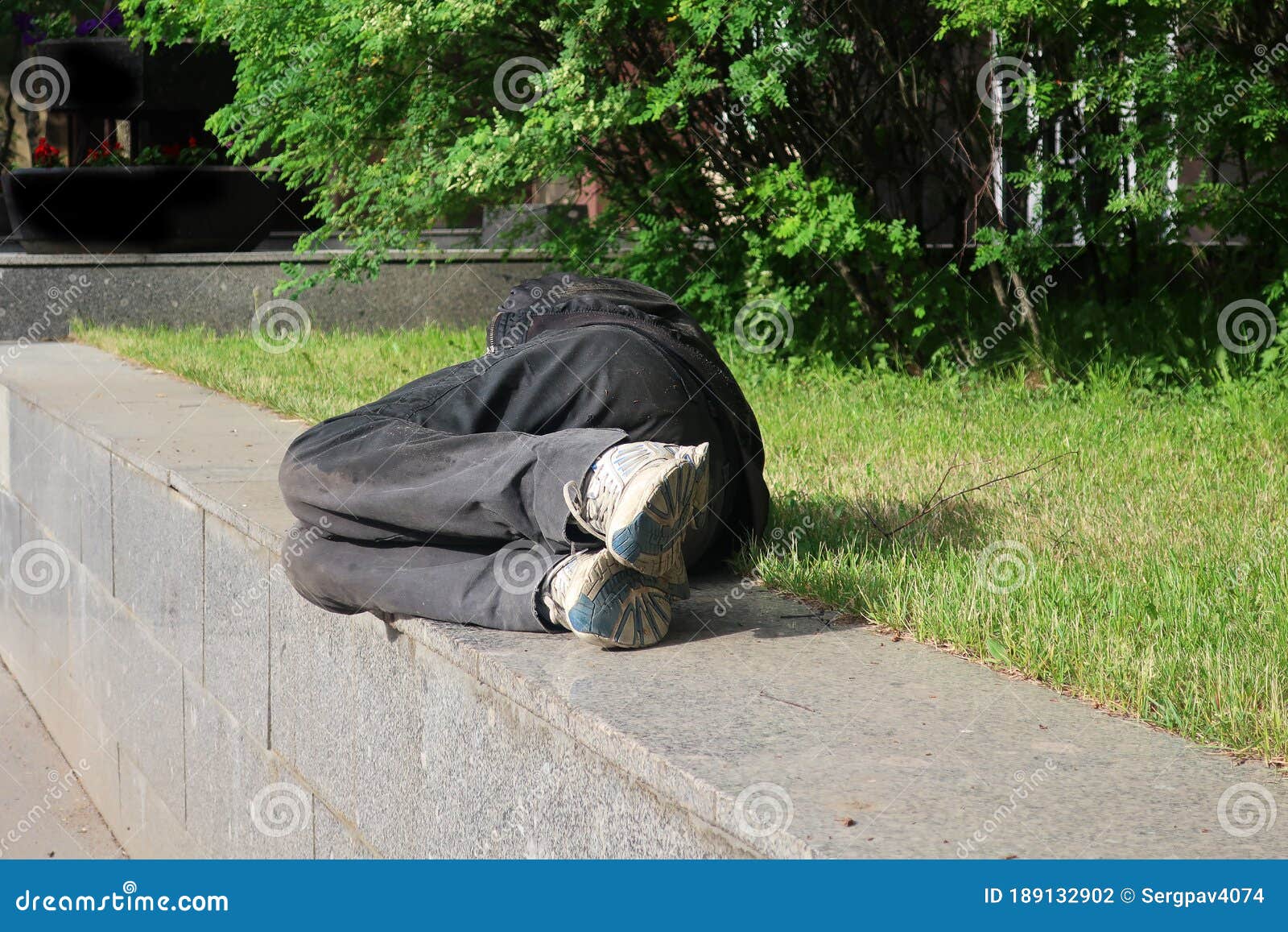 Man lying on the curb stock photo. Image of fainting - 189132902