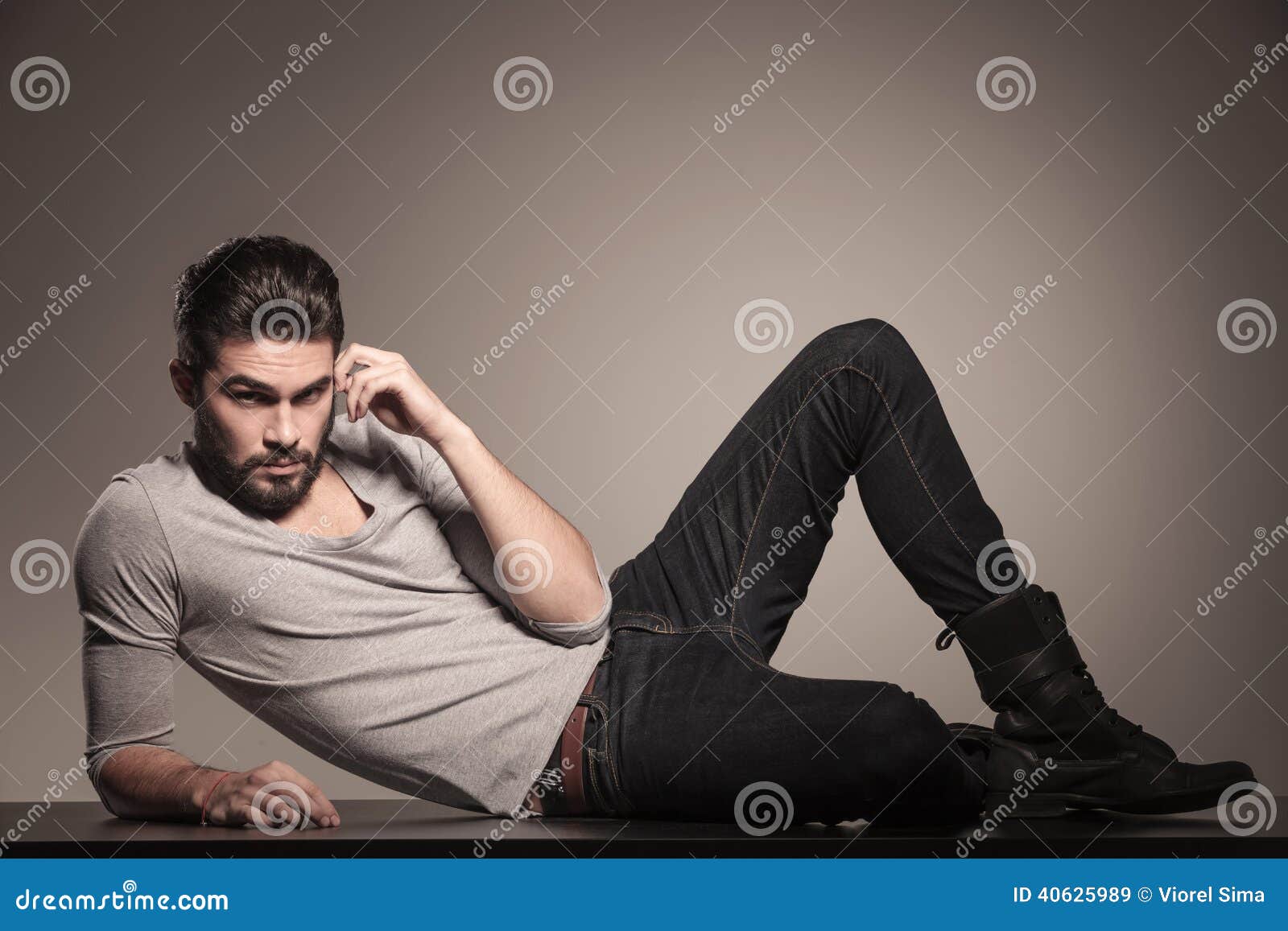 Man Lying Down on the Floor and Thinking Stock Image - Image of jeans ...