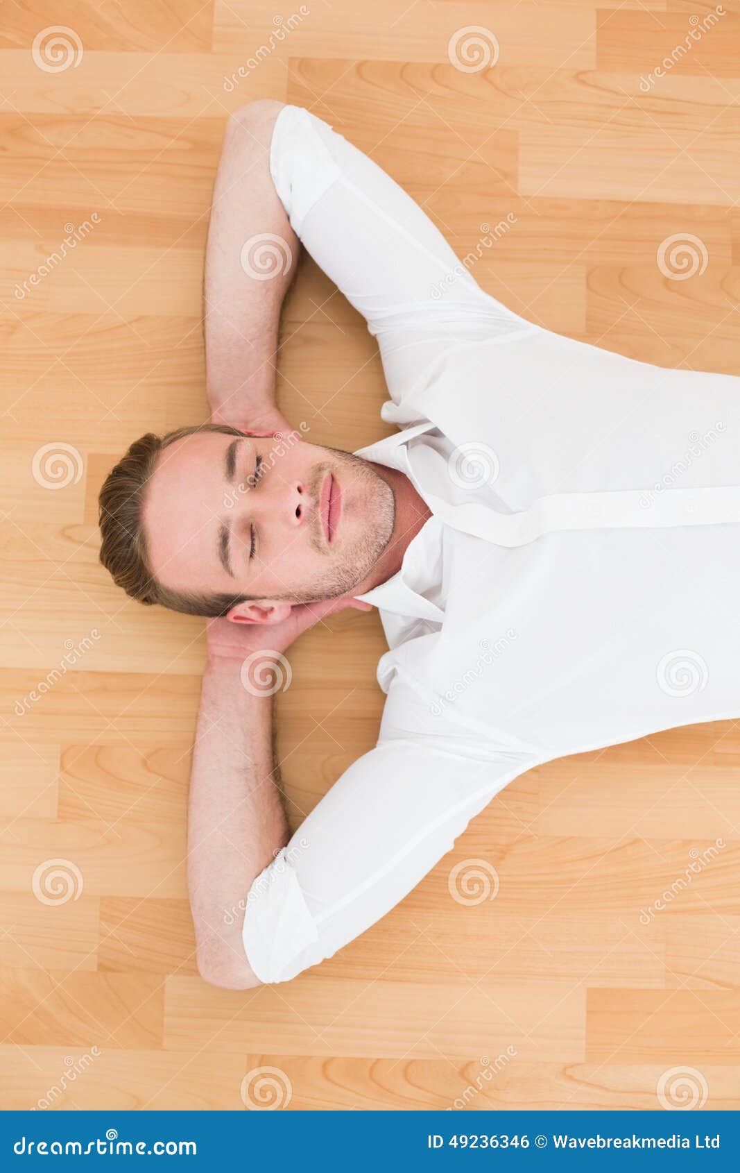 A Man Lying on Floor at Home Stock Photo - Image of flooring, room ...