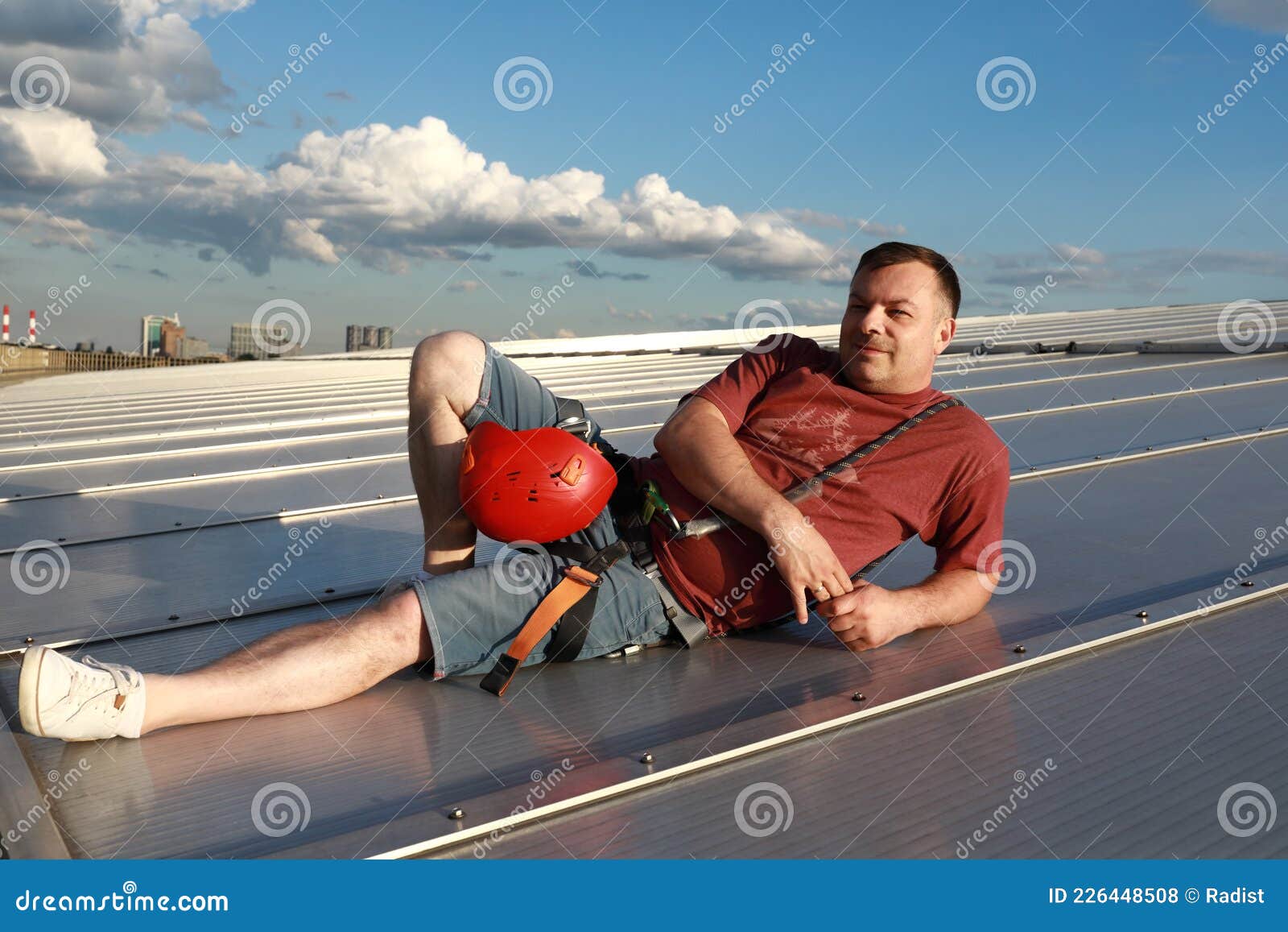 Man Lying on Roof of Building Stock Photo - Image of evening, outdoor ...