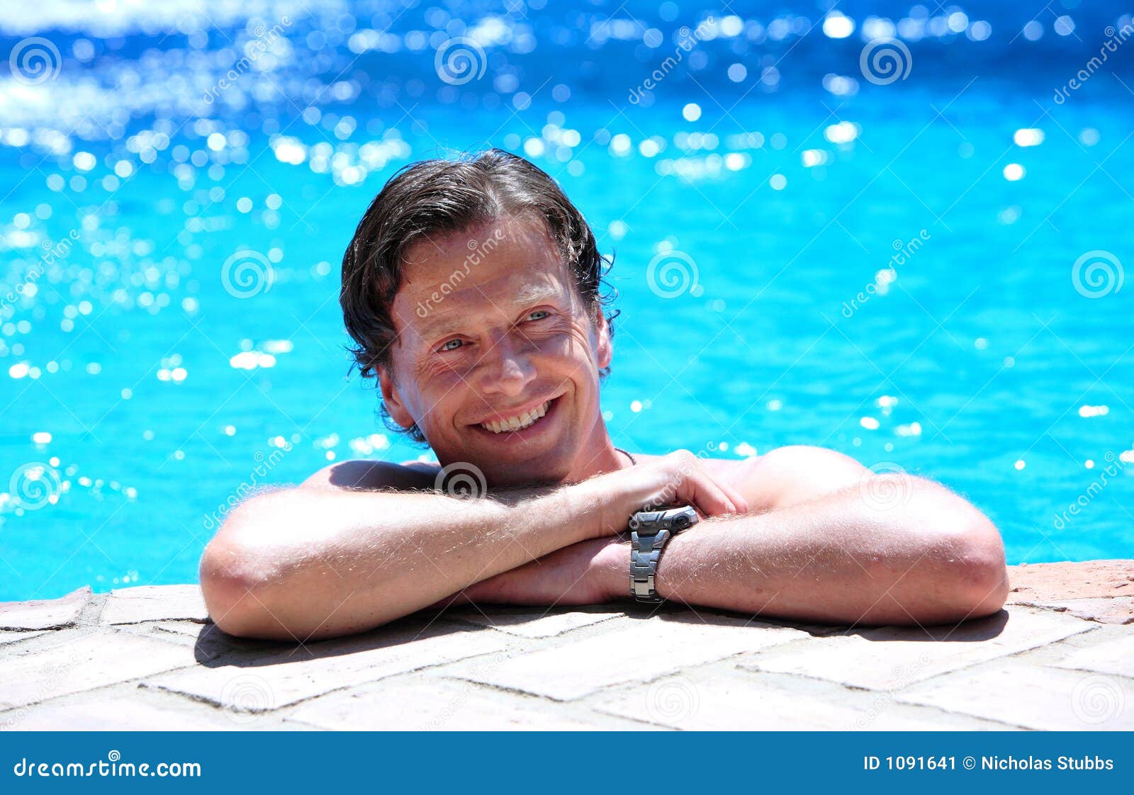 Man Lying on Side of Swimming Pool in the Sun Stock Image - Image of ...