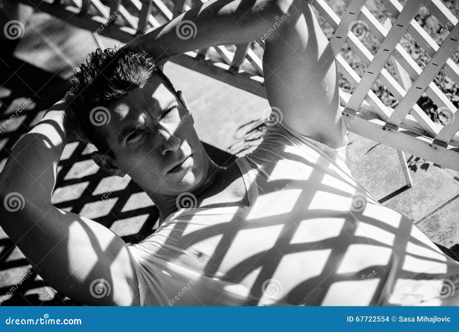 Man Lying on the Sun Looking in To Camera Stock Photo - Image of ...