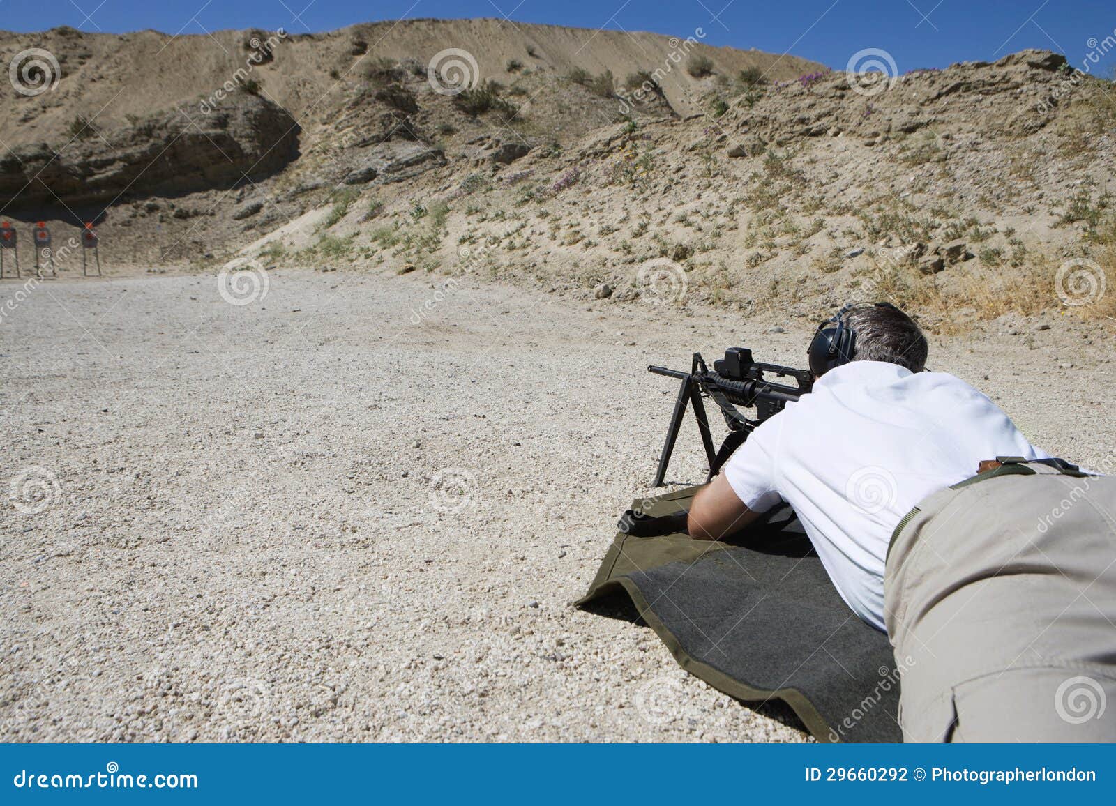 Man with Machine Gun stock photo. Image of armed, adult - 29660292