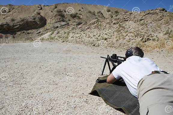 Man with Machine Gun stock photo. Image of armed, adult - 29660292