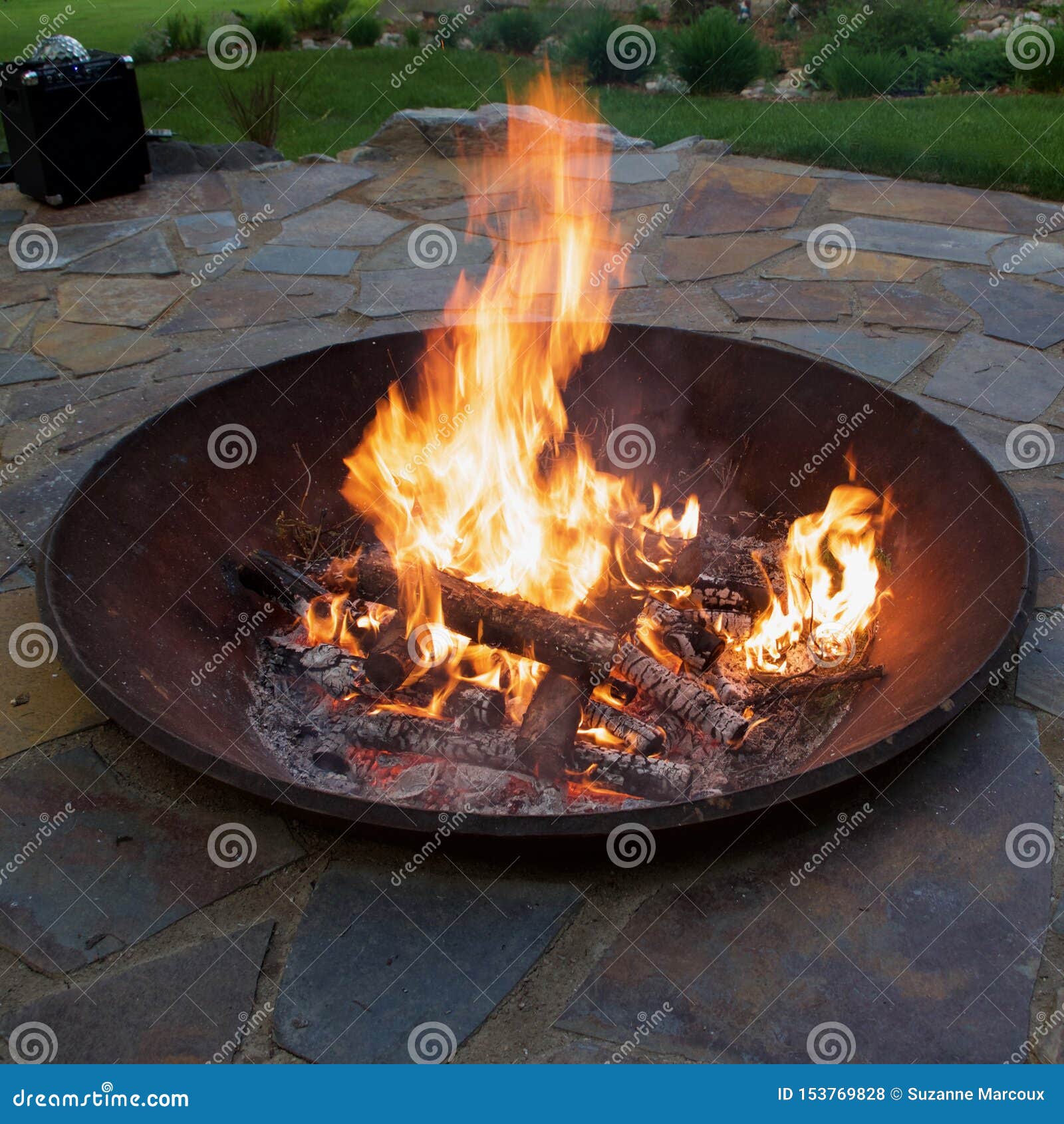 Garden Fire Pit at Sunset stock photo. Image of firepit - 153769828