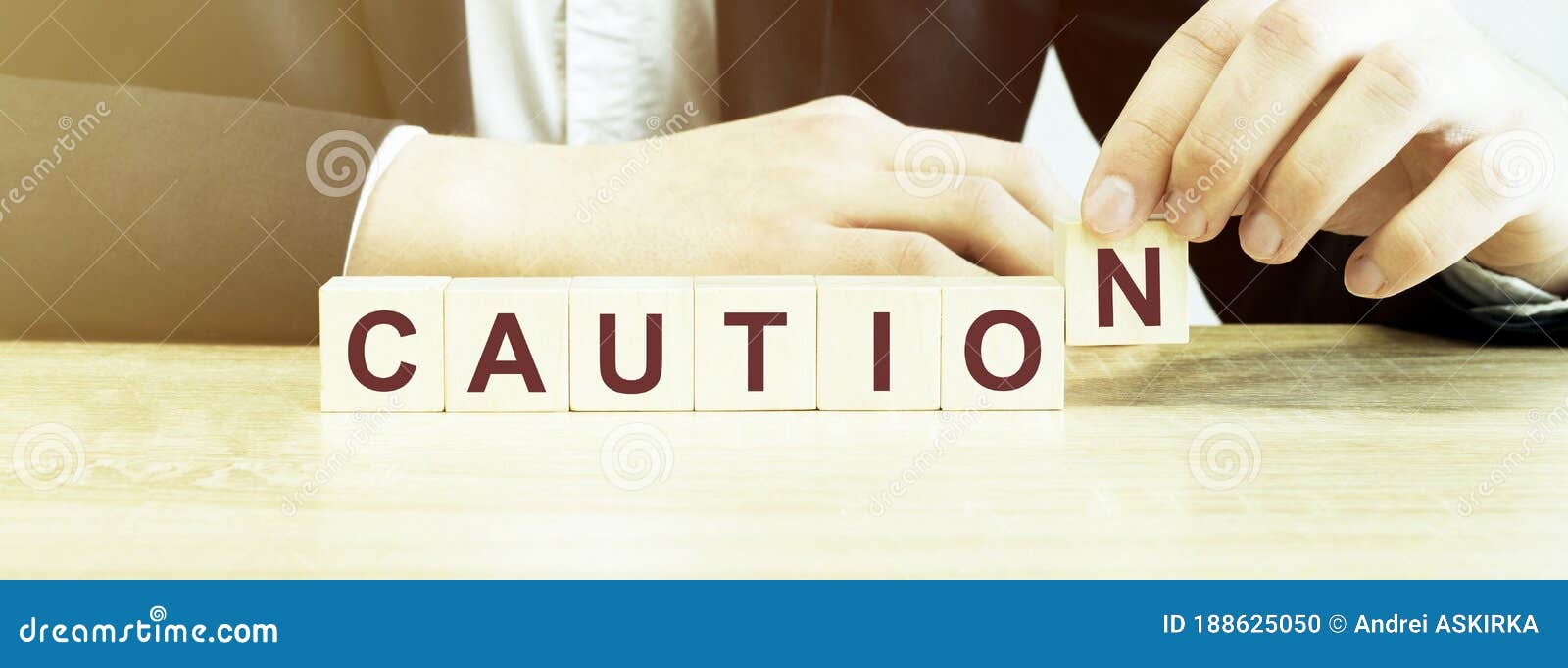 Man Made Word Caution with Wood Blocks Stock Photo - Image of ...
