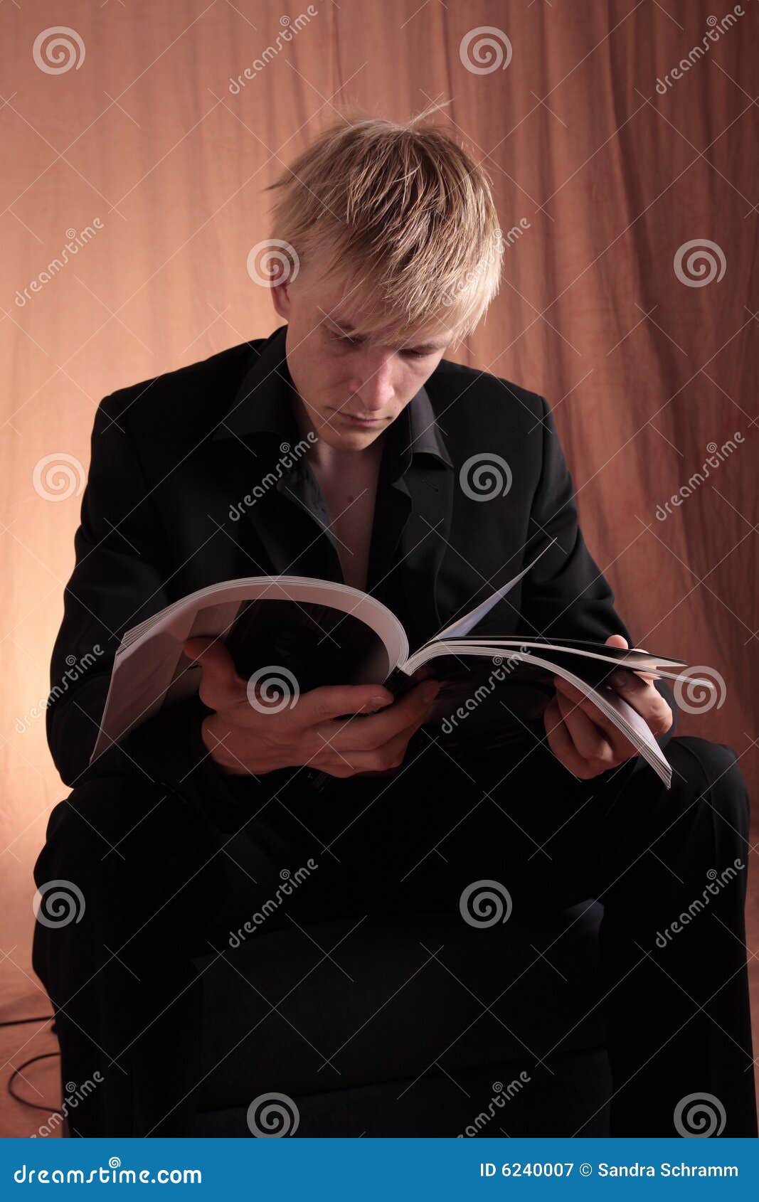 Man and magazine stock image. Image of black, sitting - 6240007