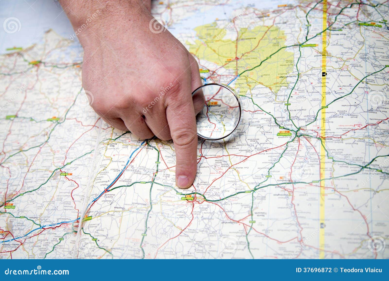 Man with Magnifier Pointing on a Map Stock Photo - Image of pointing ...