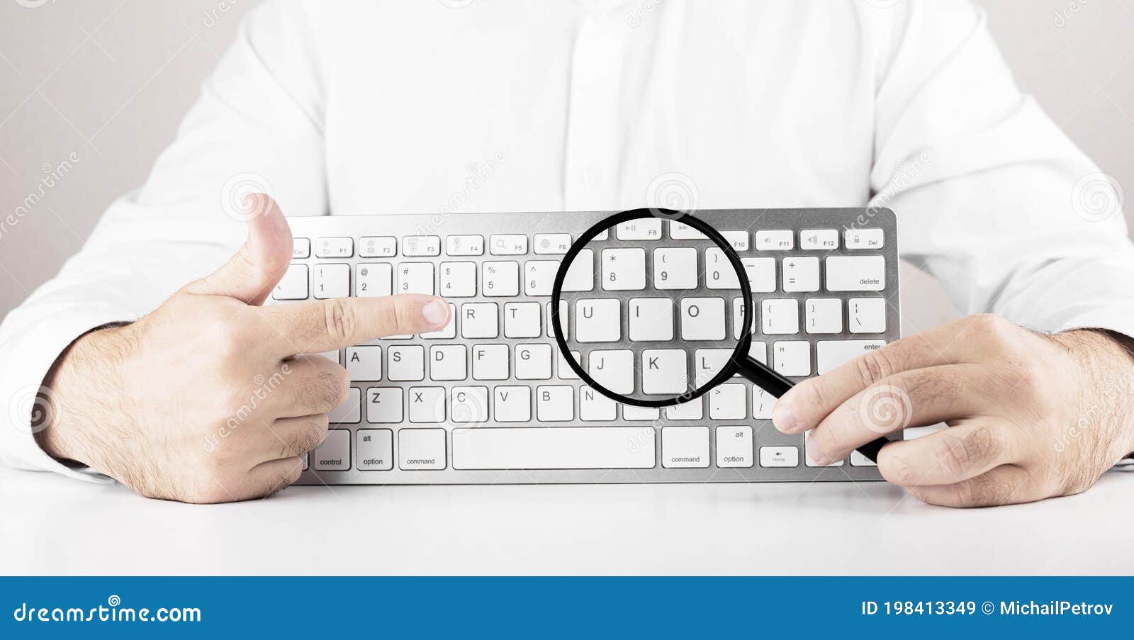 Man with Magnifying Glass and White Keyboard of Computer or Laptop ...