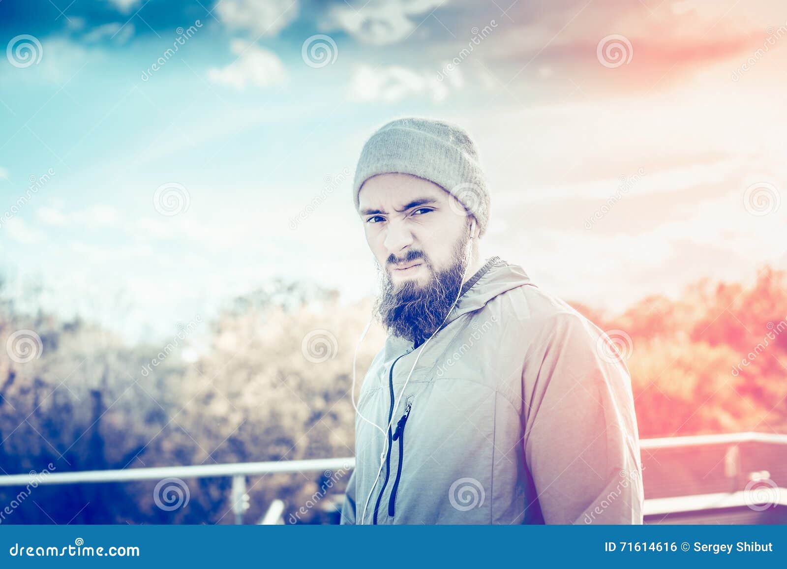 Man Makes Angry Face on the Background of Sunset Spring Sky, Standing ...