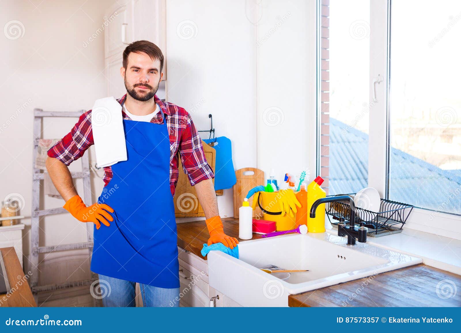 Man Makes Cleaning the Kitchen. Young Man Washes the Dishes. Cleaning ...