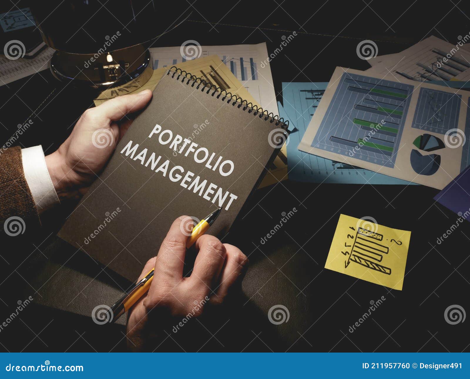 Man Makes Notes about Portfolio Management in Notepad. Stock Photo ...