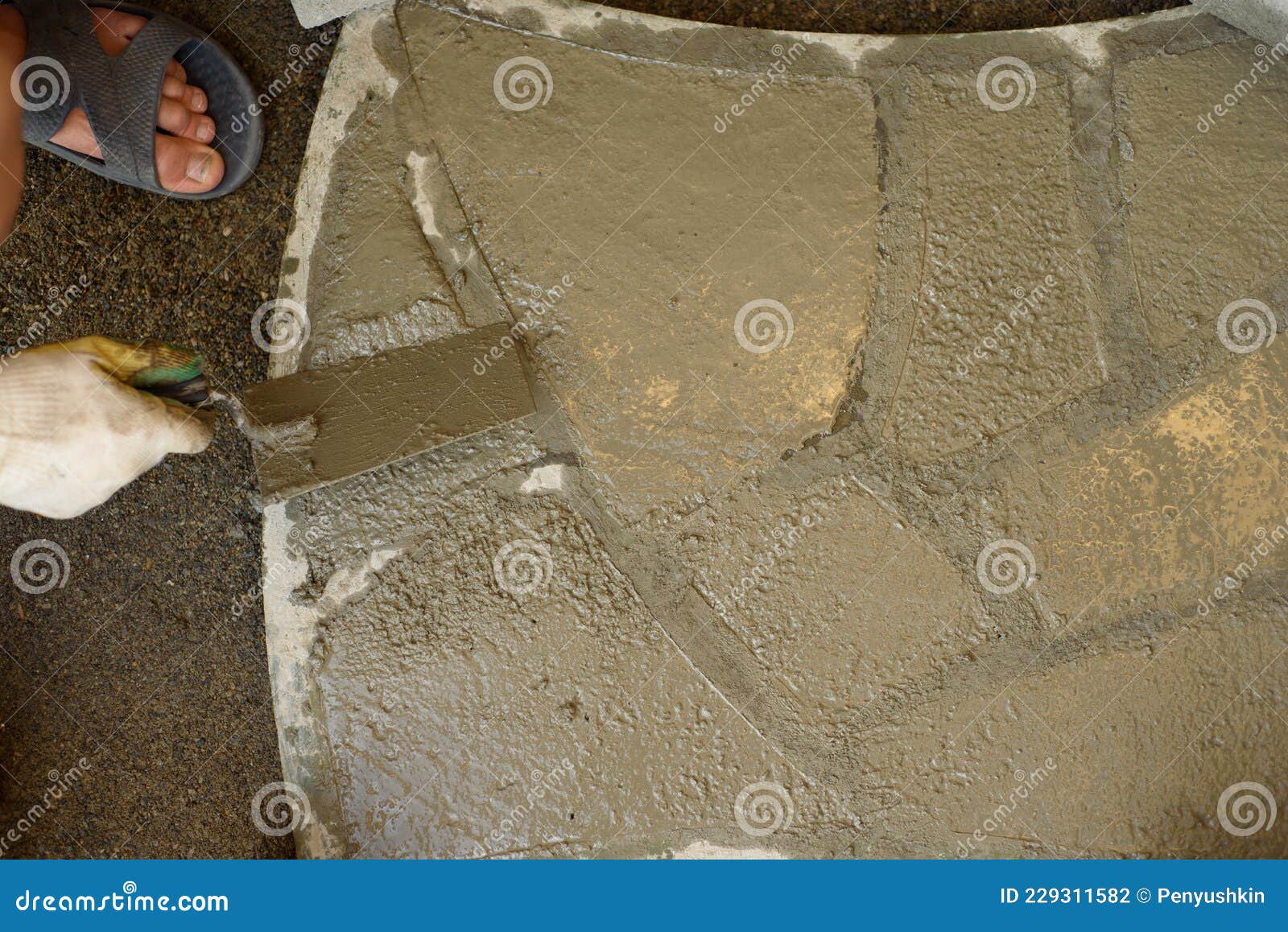 A Man Makes Paving Slabs from Cement Mortar Stock Photo - Image of ...