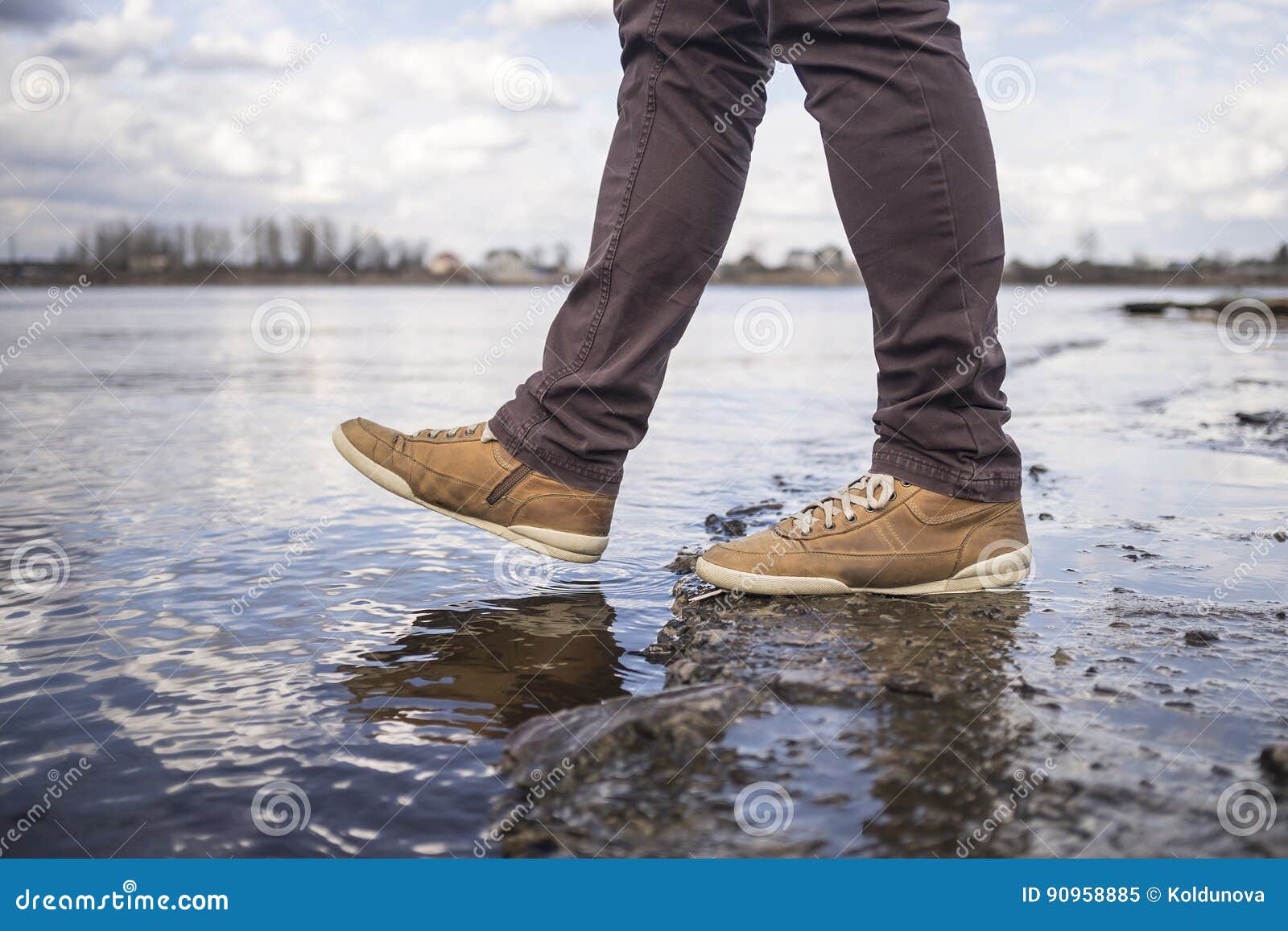 Man Makes a Step into the Water Stock Image - Image of plash, boots ...