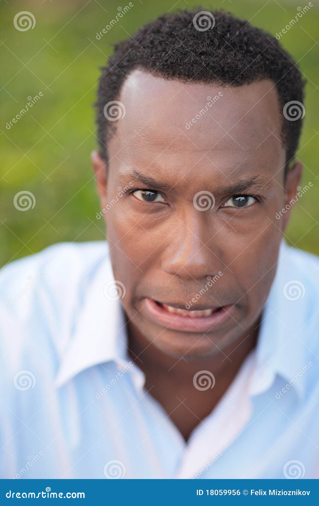 Man making an angry face stock photo. Image of outdoors - 18059956