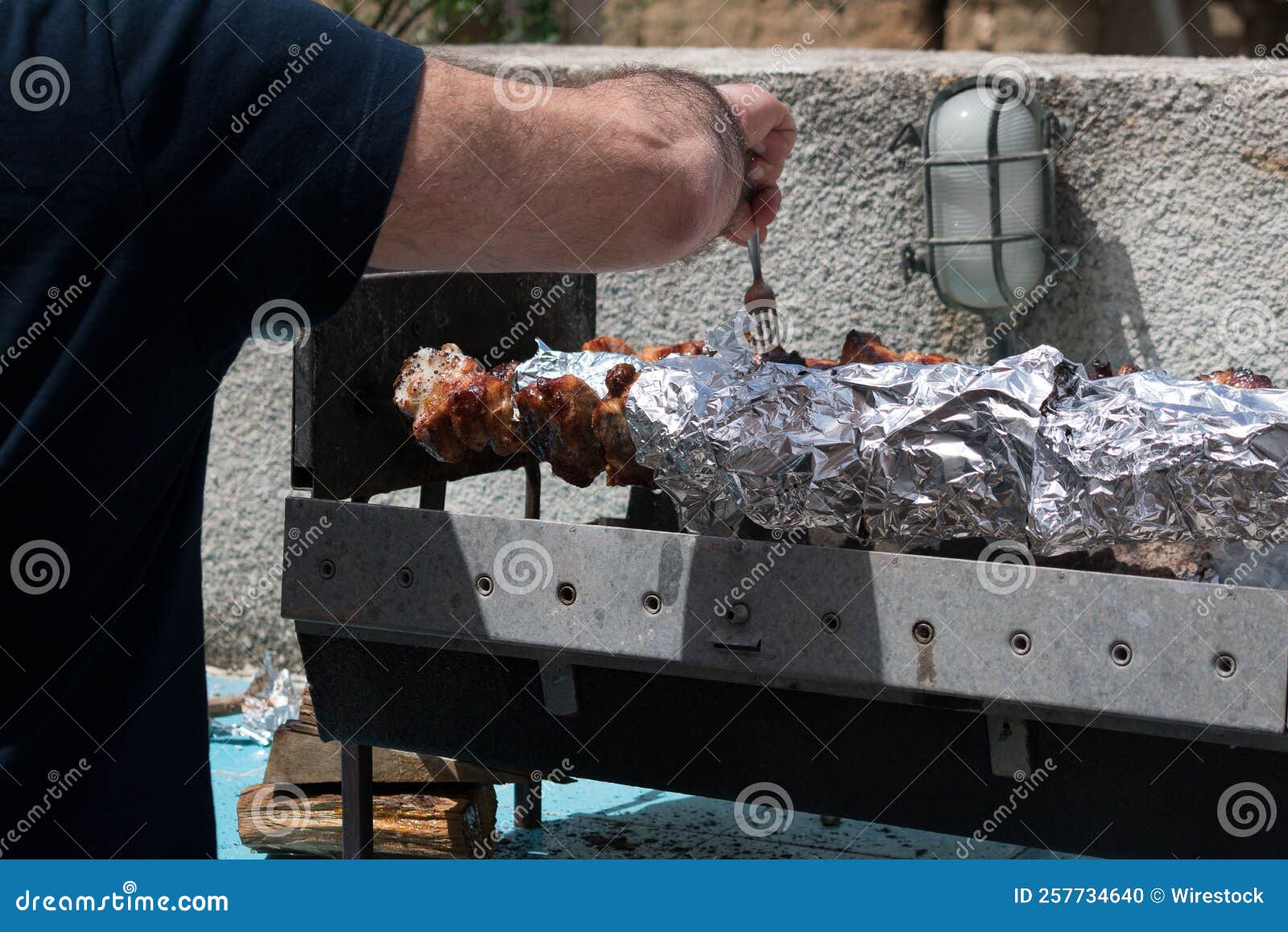 Man Making Barbecue in the Foil Stock Photo - Image of cooking, kitchen ...