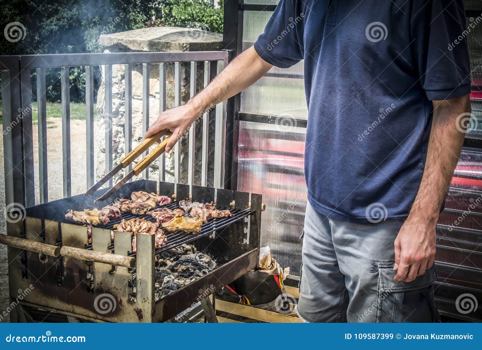 A man making barbecue stock image. Image of lifestyle - 109587399