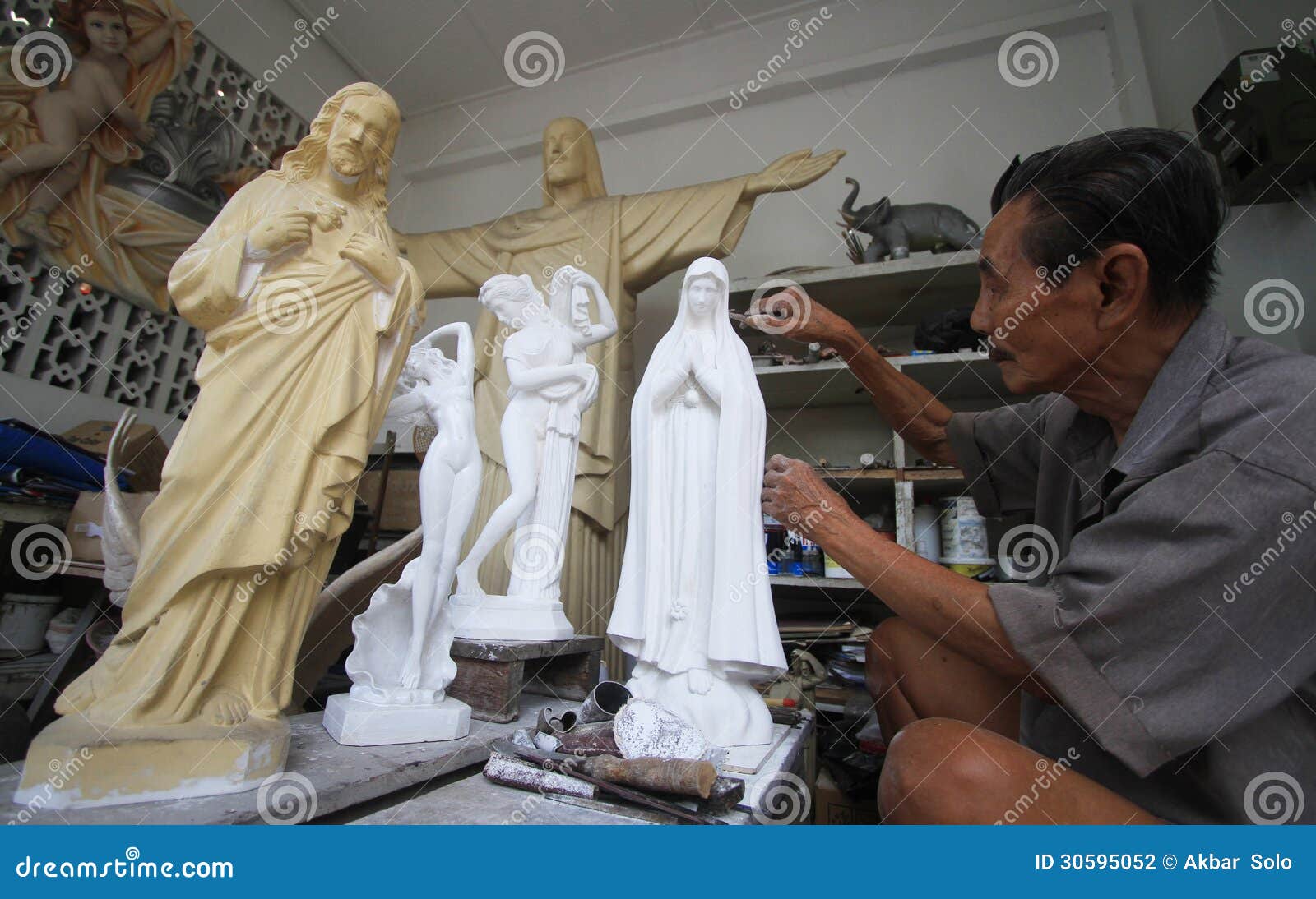 A Man Making Christmas Statue Editorial Photography - Image of catholic ...