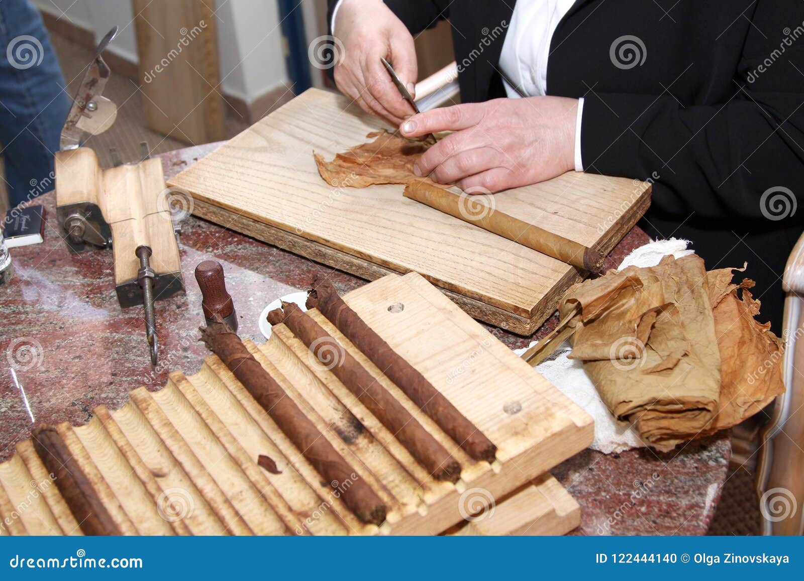 Man making cigars manually stock photo. Image of dried - 122444140