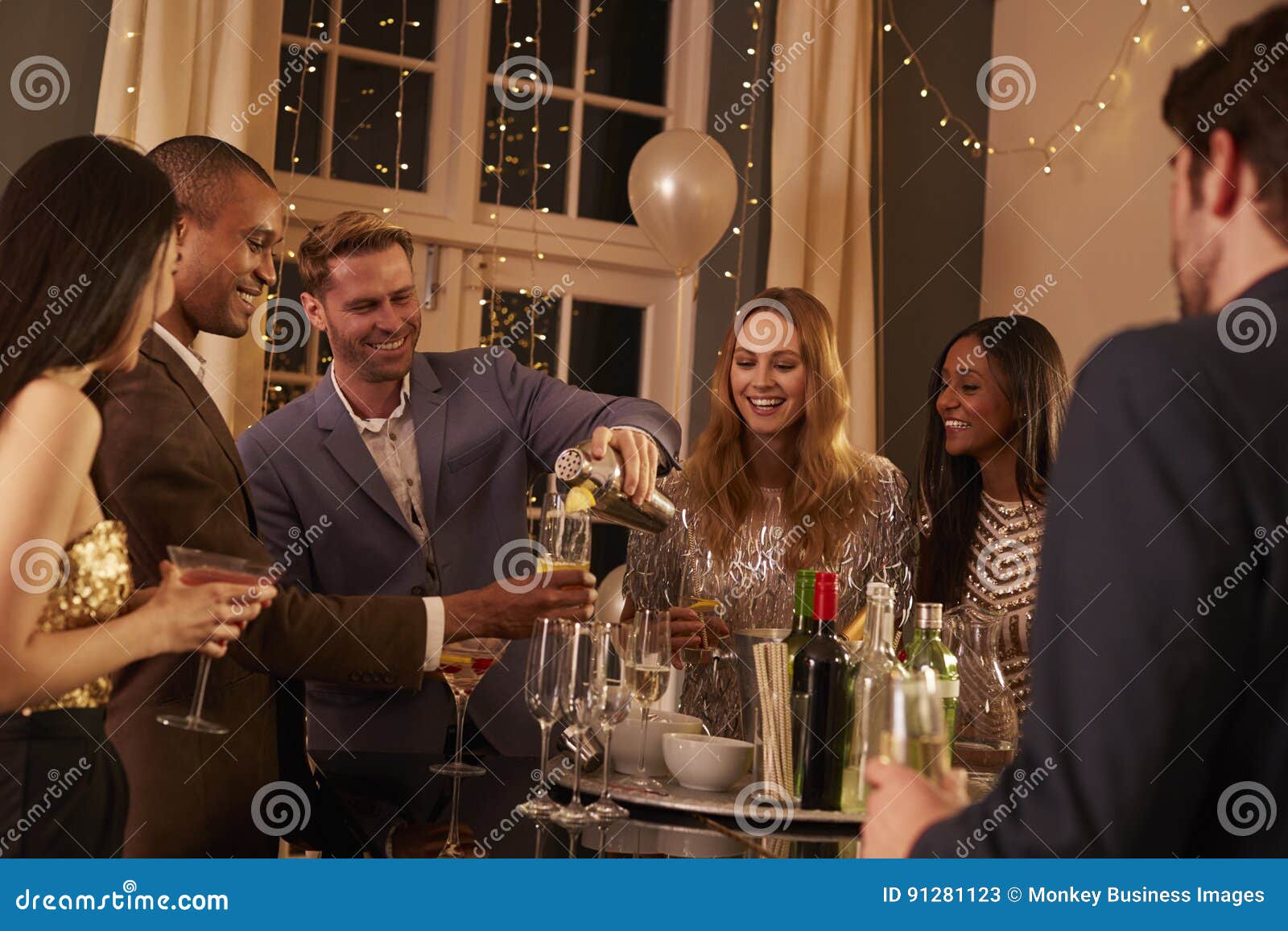 Man Making Cocktails for Friends at Party Stock Image - Image of making ...