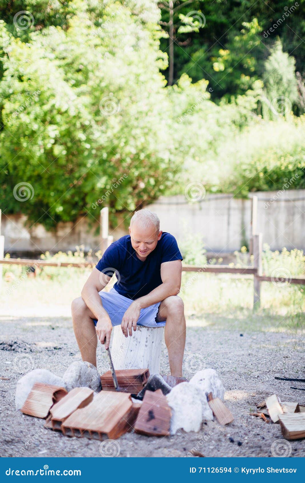Man making fire for bbq stock photo. Image of adult, garden - 71126594