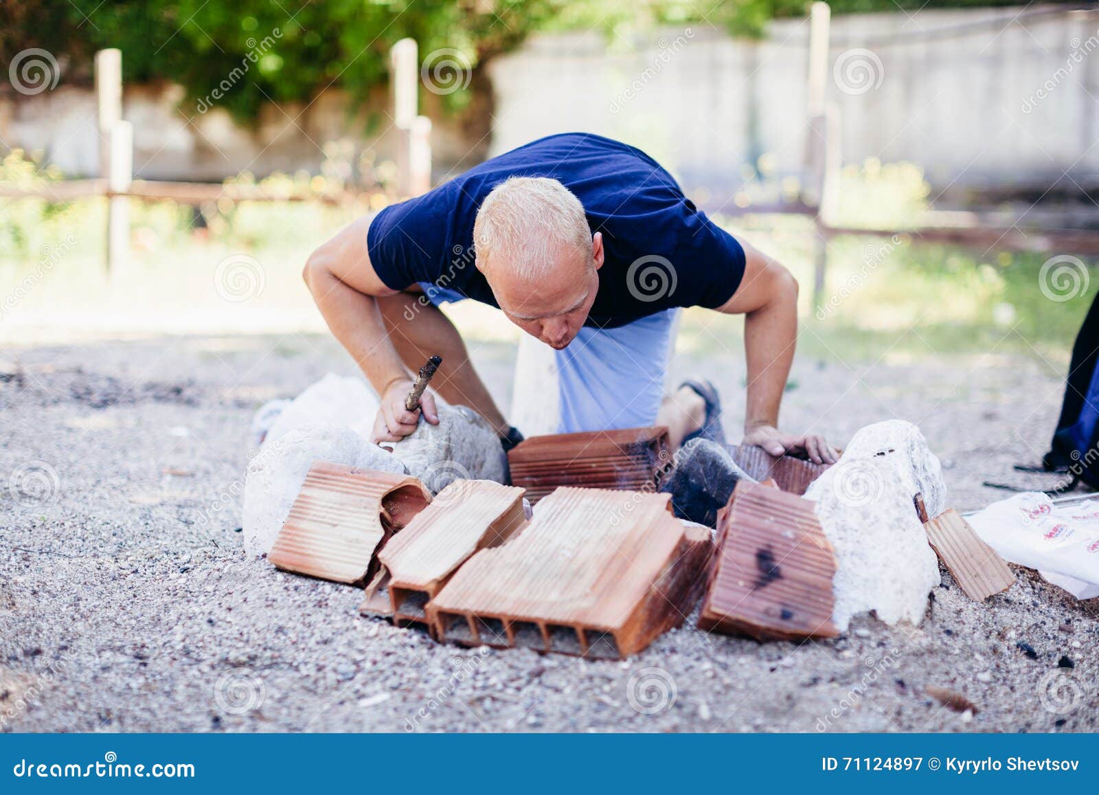 Man making fire for BBQ stock image. Image of summer - 71124897