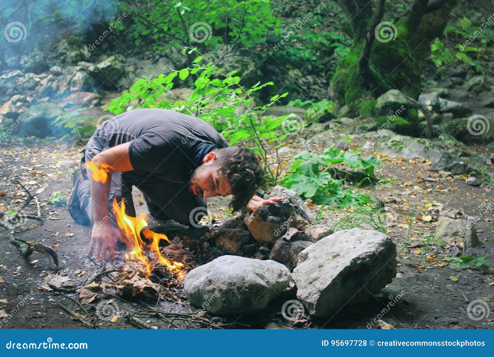 Man Making Fire In Countryside Picture. Image: 95697728