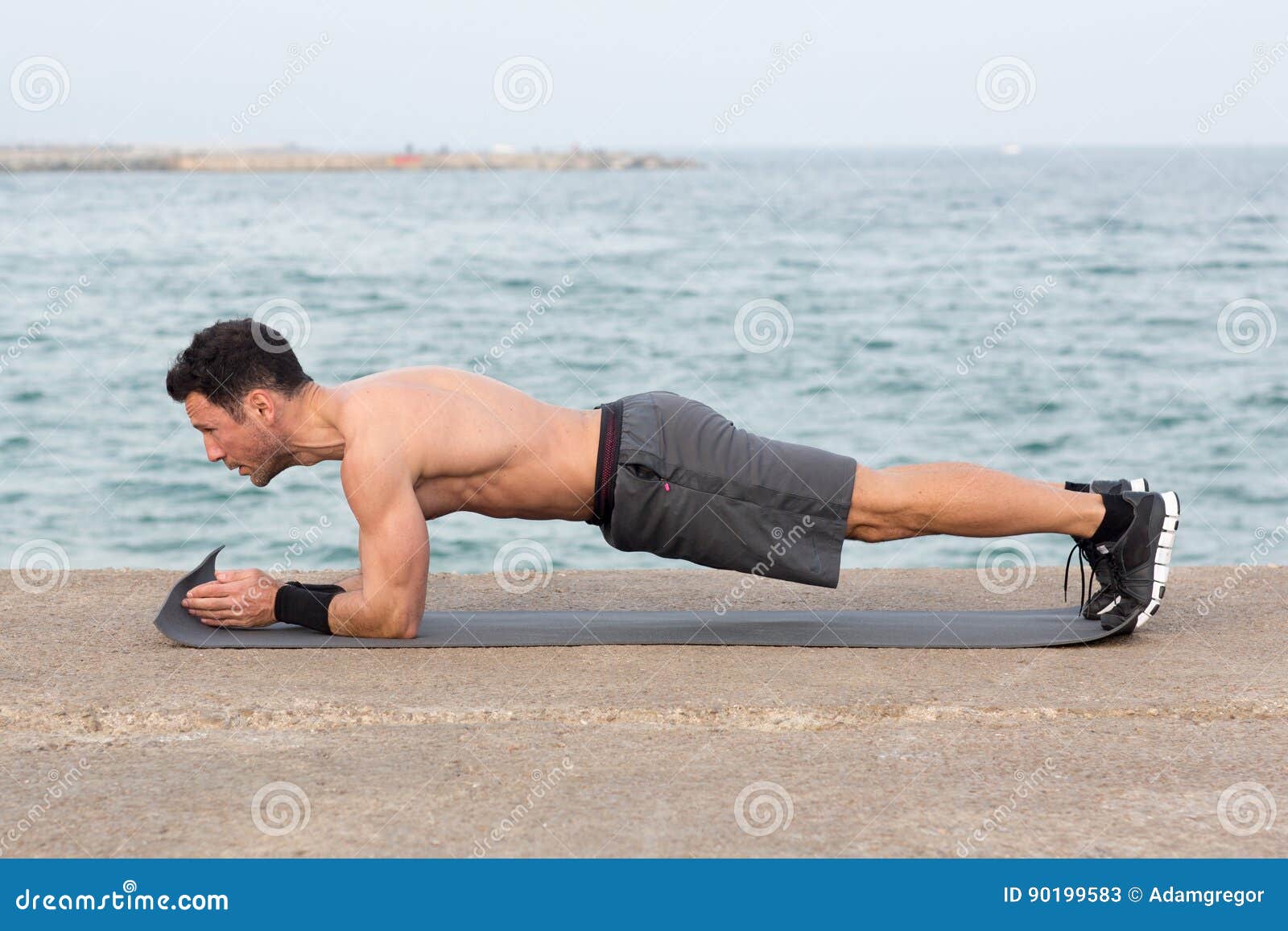 Man making forearm plank stock image. Image of standard - 90199583