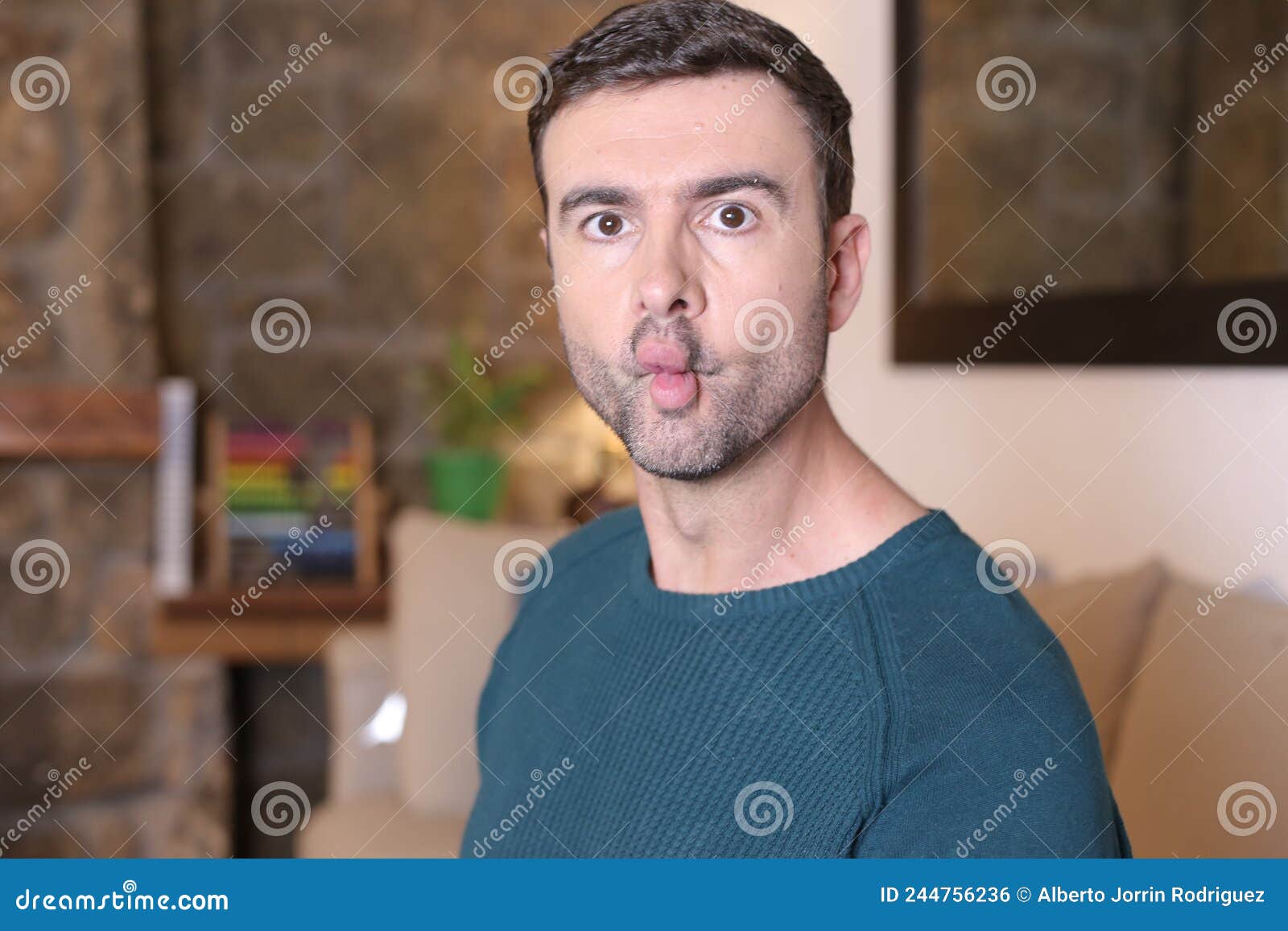 Man making funny fish face stock photo. Image of caucasian - 244756236