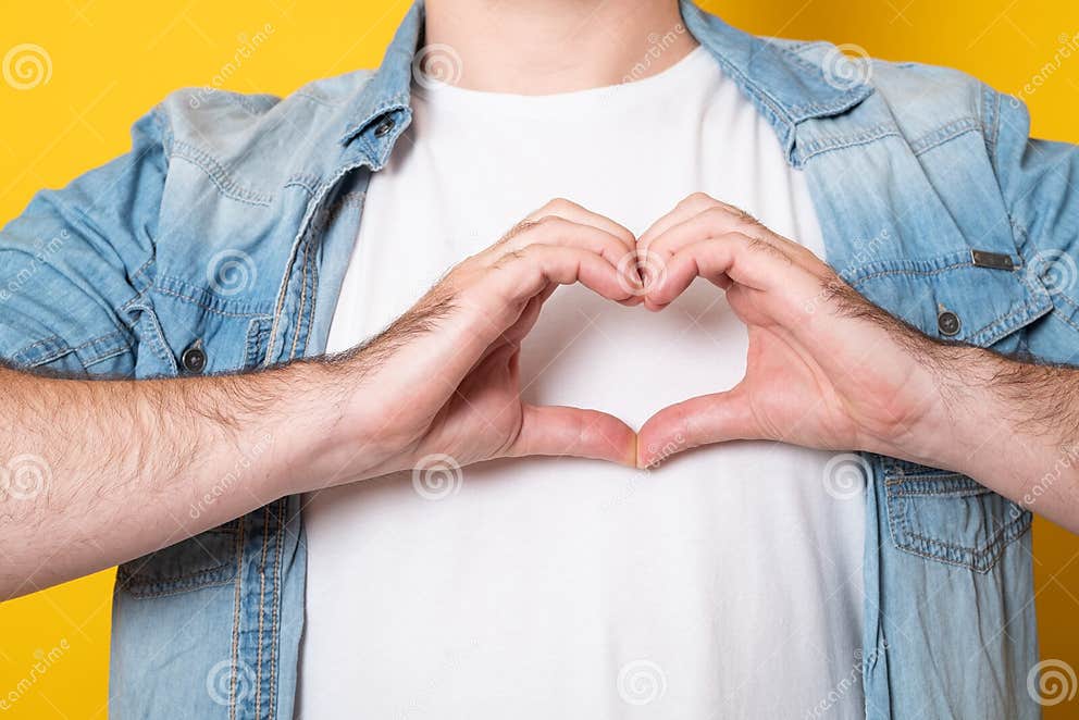 Man making a hand heart stock photo. Image of heart - 211085946