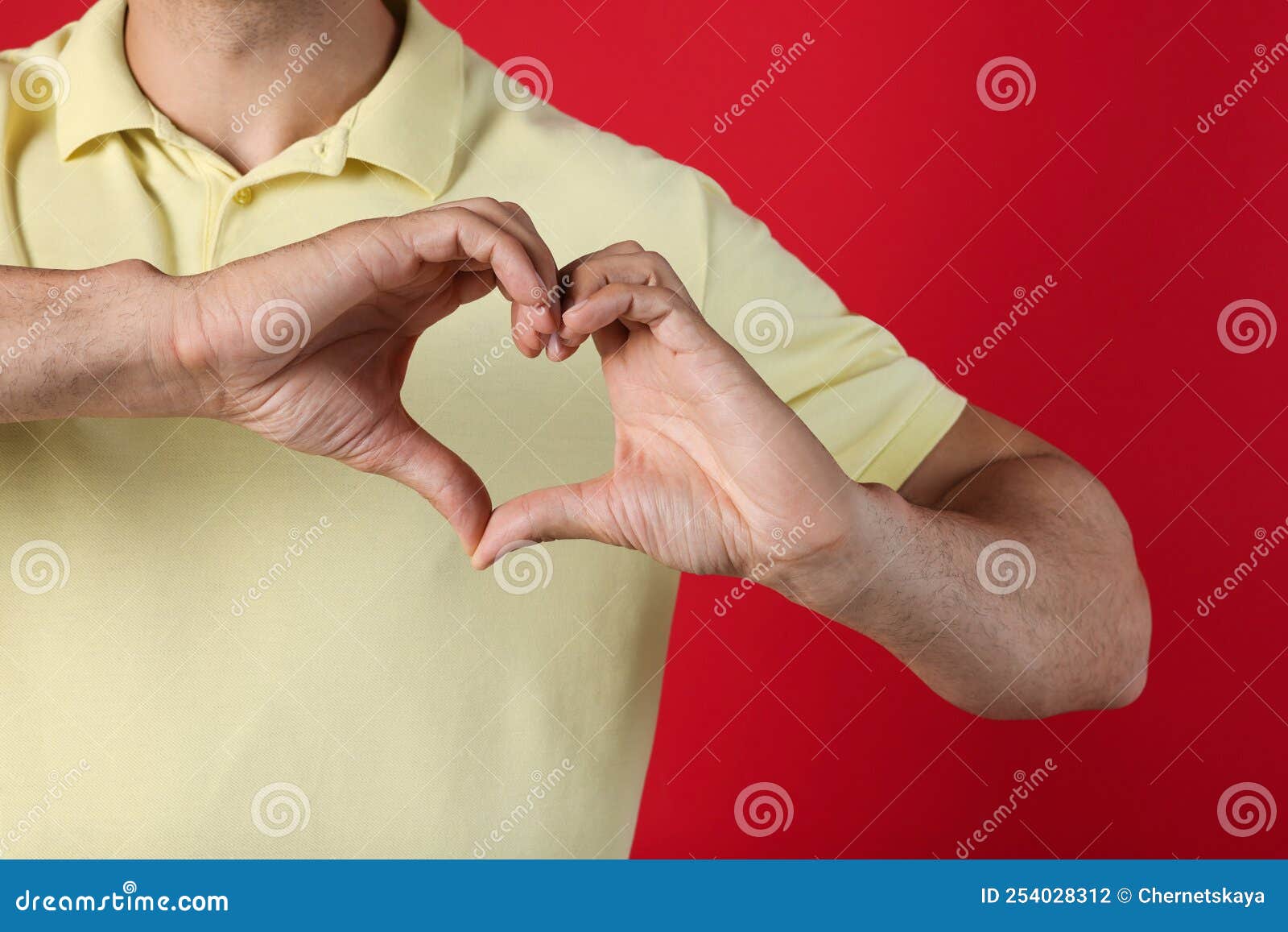Man Making Heart with Hands on Red Background, Closeup Stock Photo ...