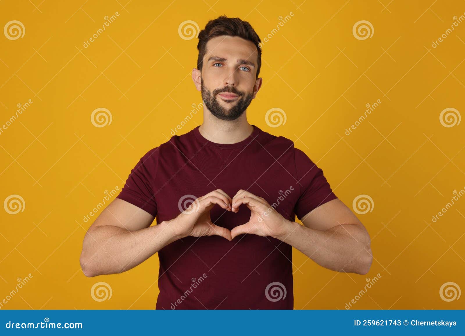 Man Making Heart with Hands on Yellow Background Stock Image - Image of ...