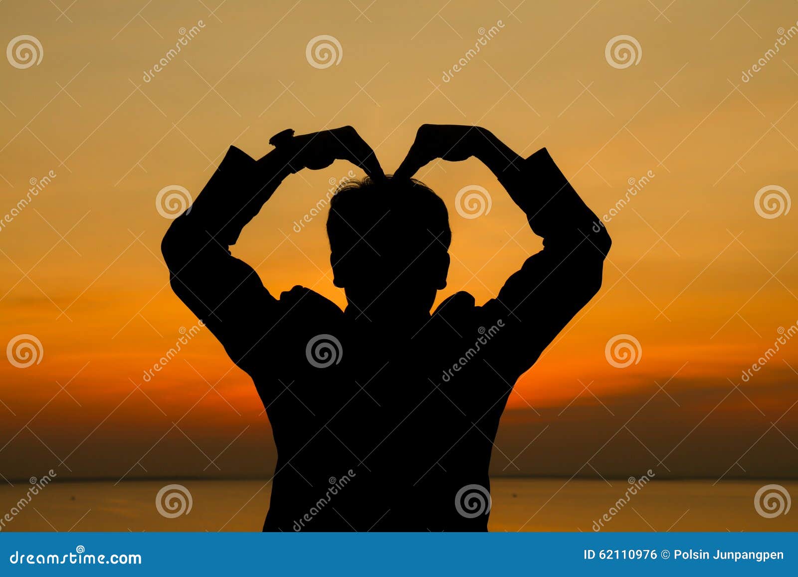 Man making heart shape. stock photo. Image of ocean, outdoors - 62110976