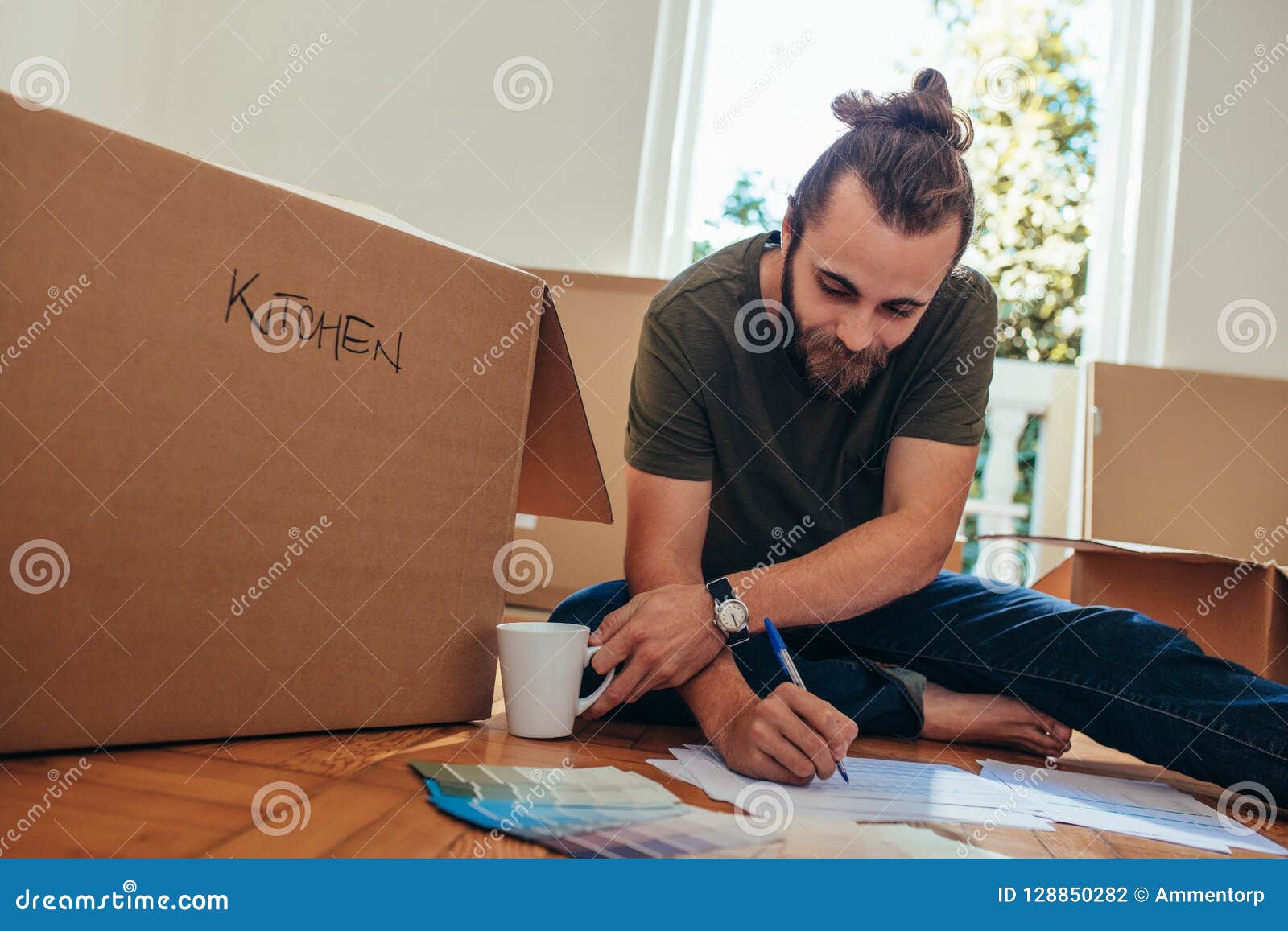 Man Making a List of Articles for Packing Stock Photo - Image of boxes ...