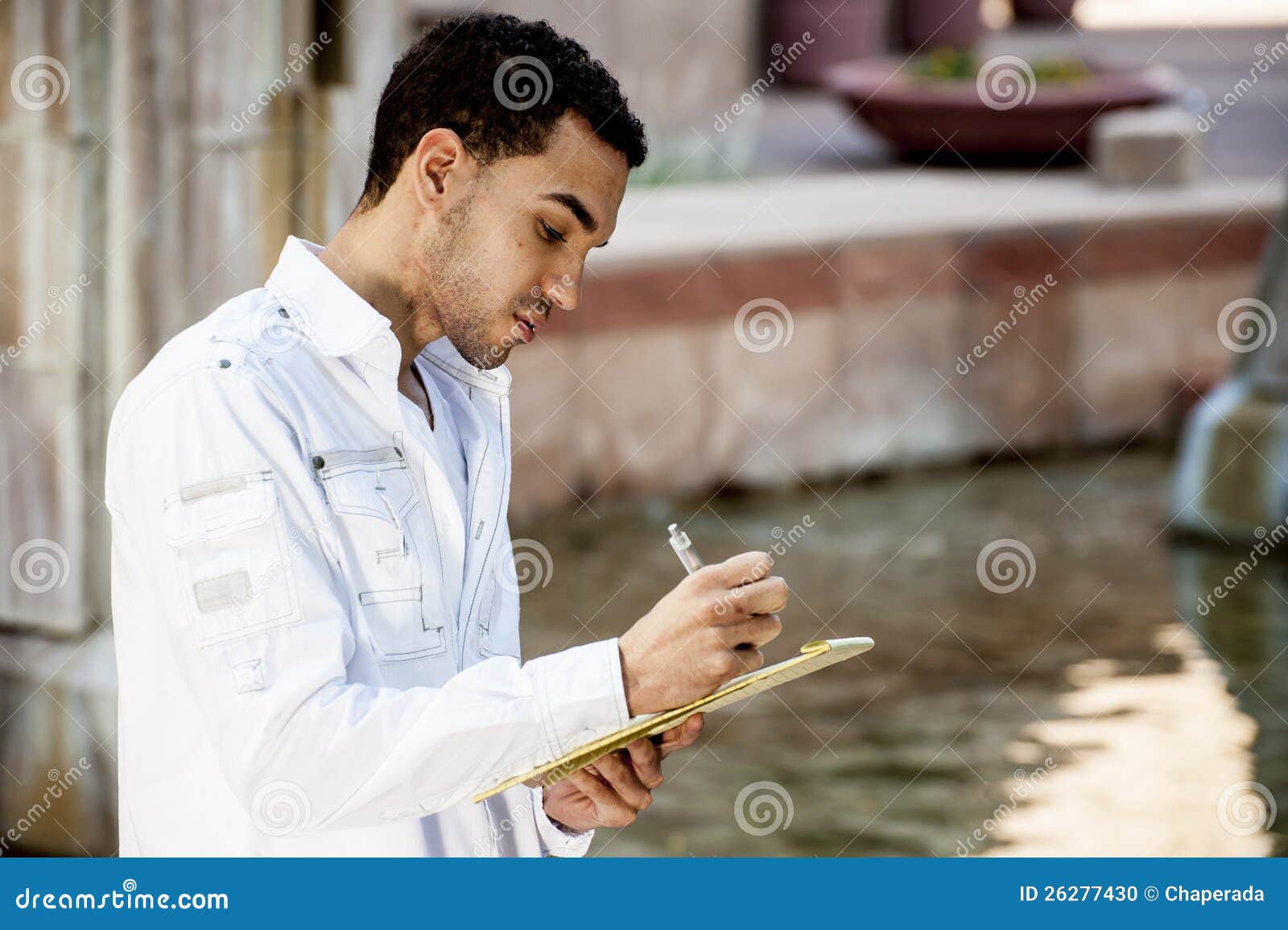 Man making notes stock photo. Image of ethnic, short - 26277430