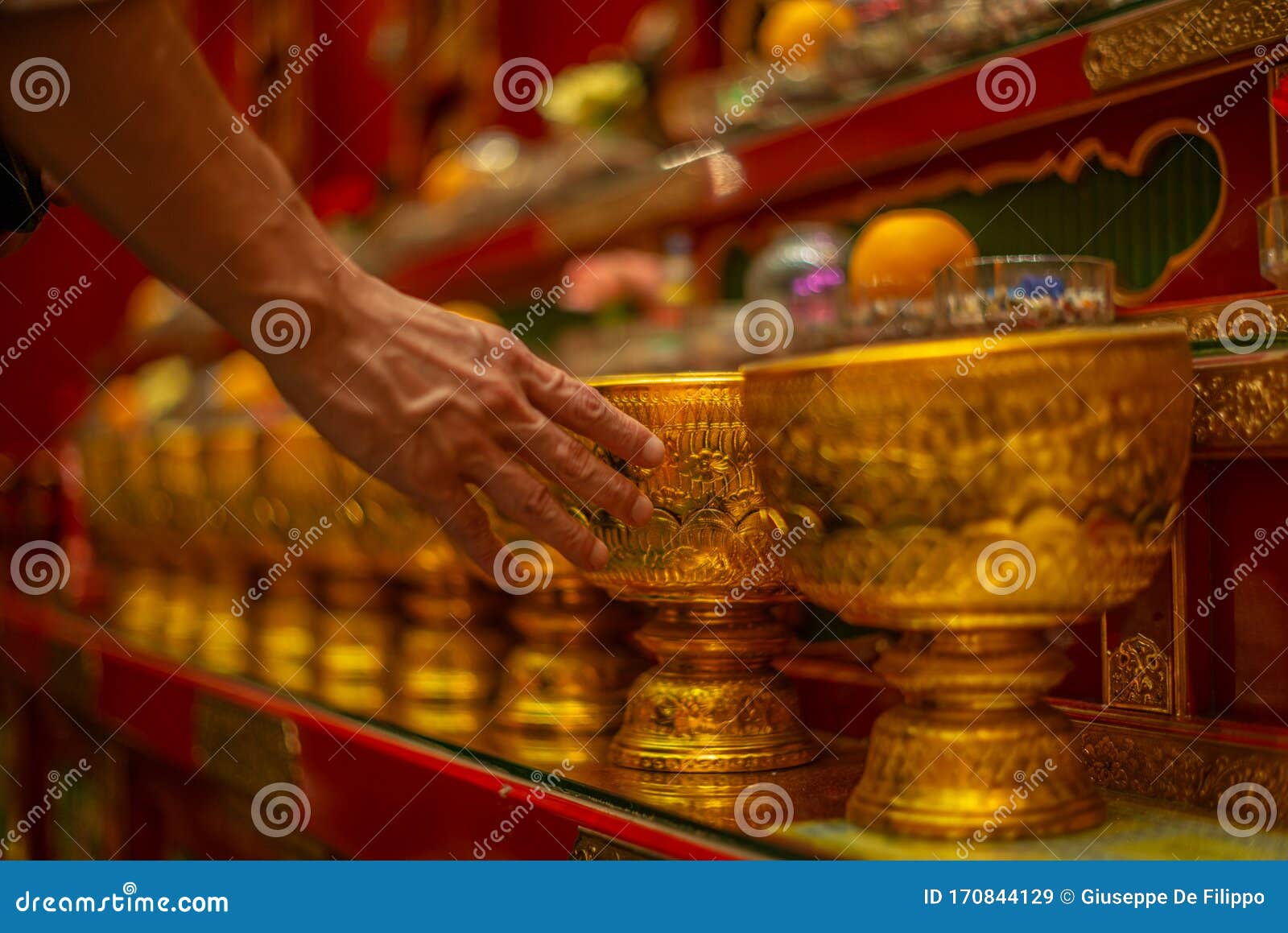 A Man Making an Offering in a Buddhist Temple in Singapore Stock Image ...