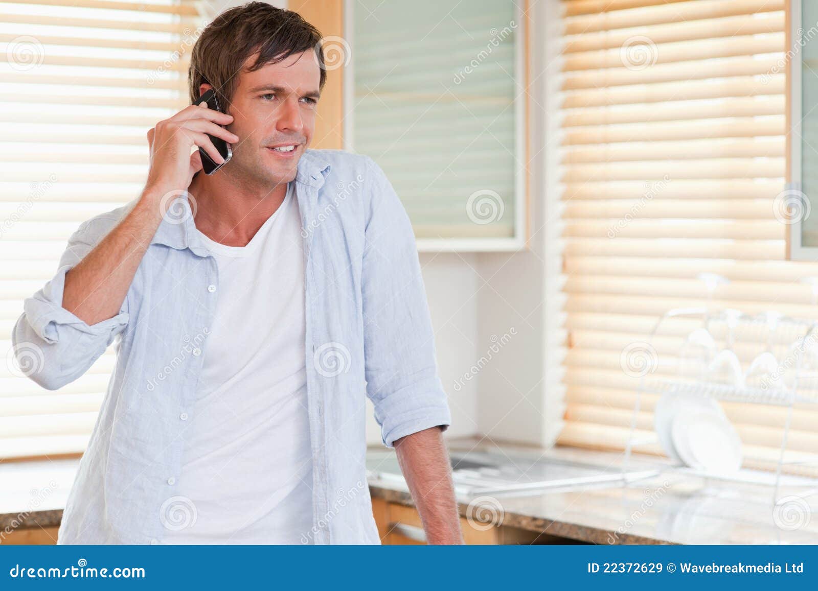 Man making a phone call stock image. Image of listen - 22372629