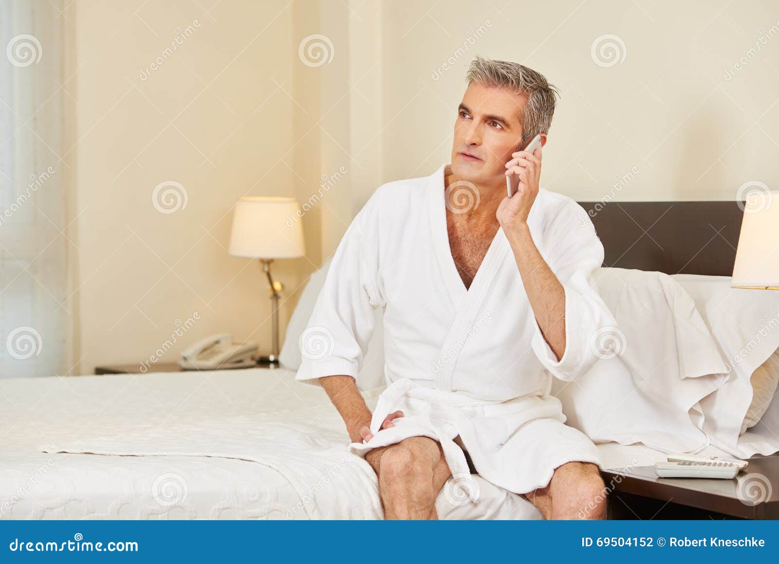 Man Making Phone Call in Hotel Room Stock Photo - Image of stay ...