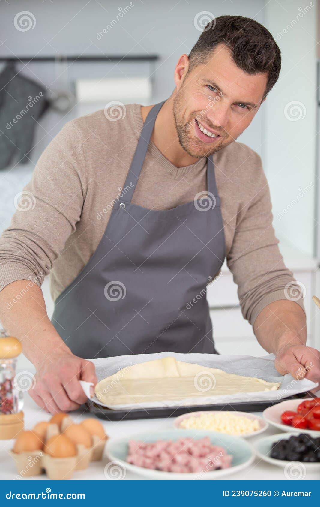 Man making pizza at home stock photo. Image of prepare - 239075260