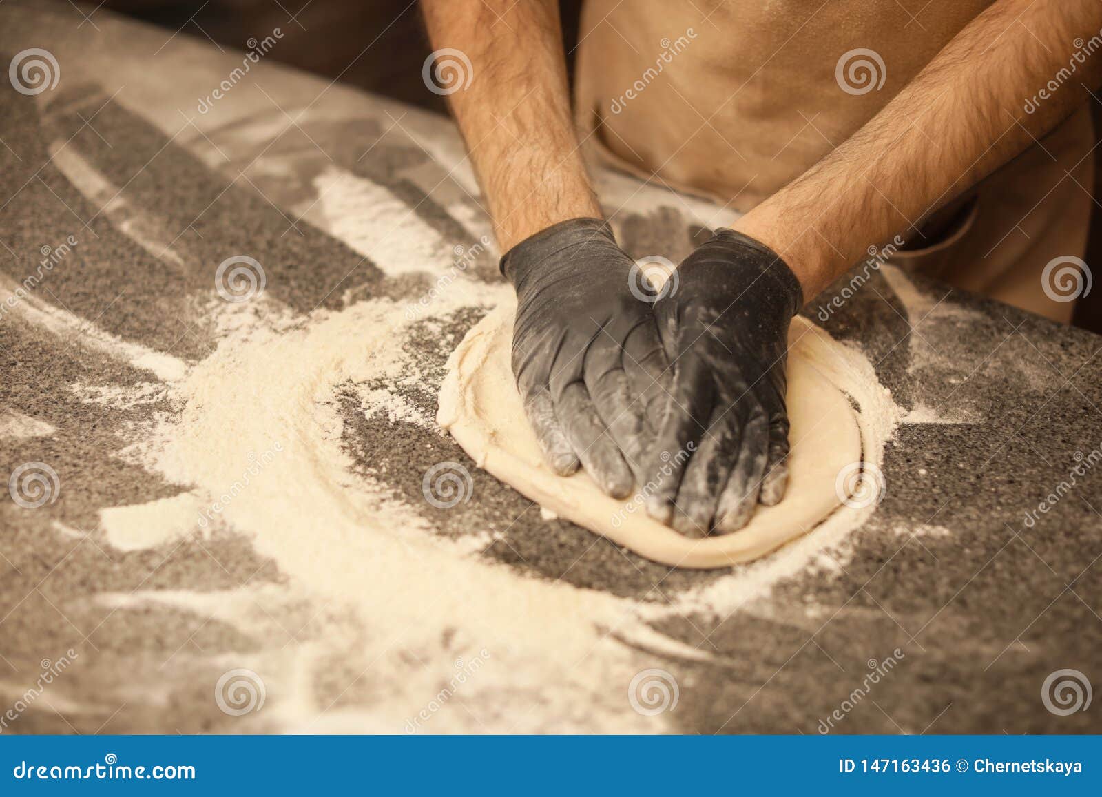 Man making pizza at table stock photo. Image of chef - 147163436